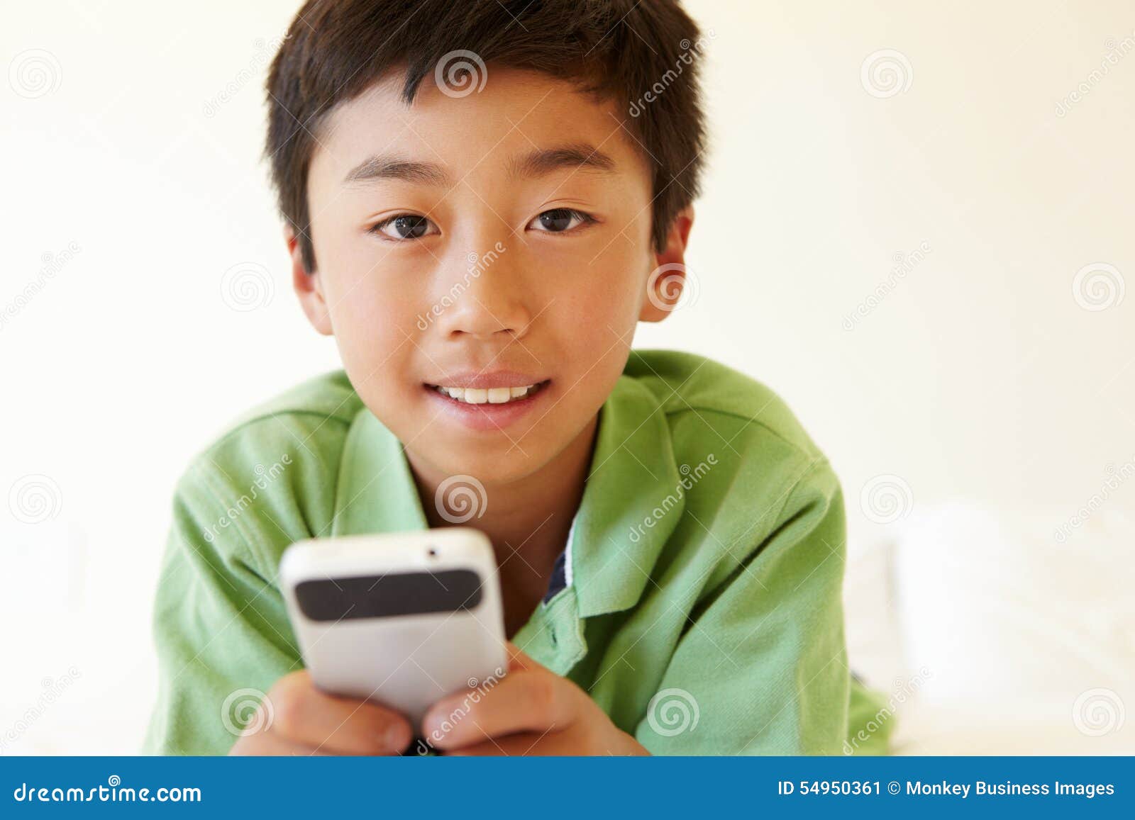 Young boy using smartphone stock image. Image of cell - 54950361