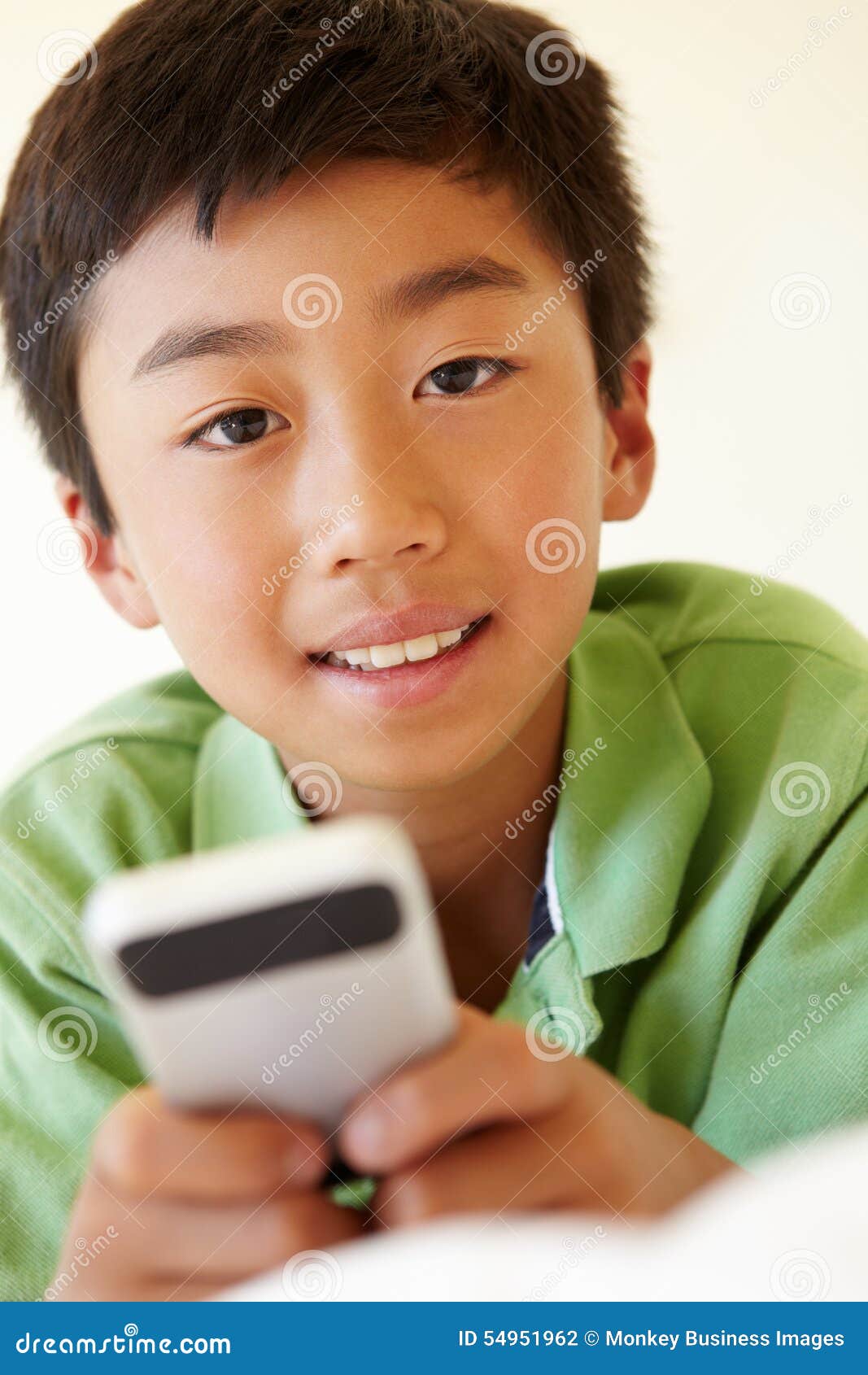 Young boy using smartphone stock photo. Image of message - 54951962