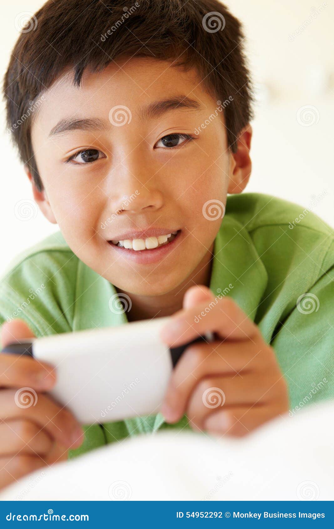 Young boy using smartphone stock photo. Image of portrait - 54952292