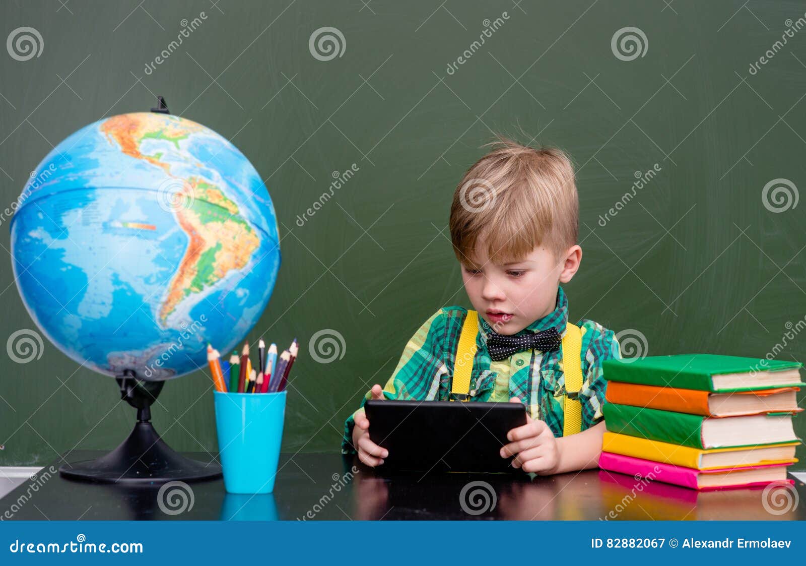 Young Boy Using Tablet Computer in Classroom Stock Image - Image of ...