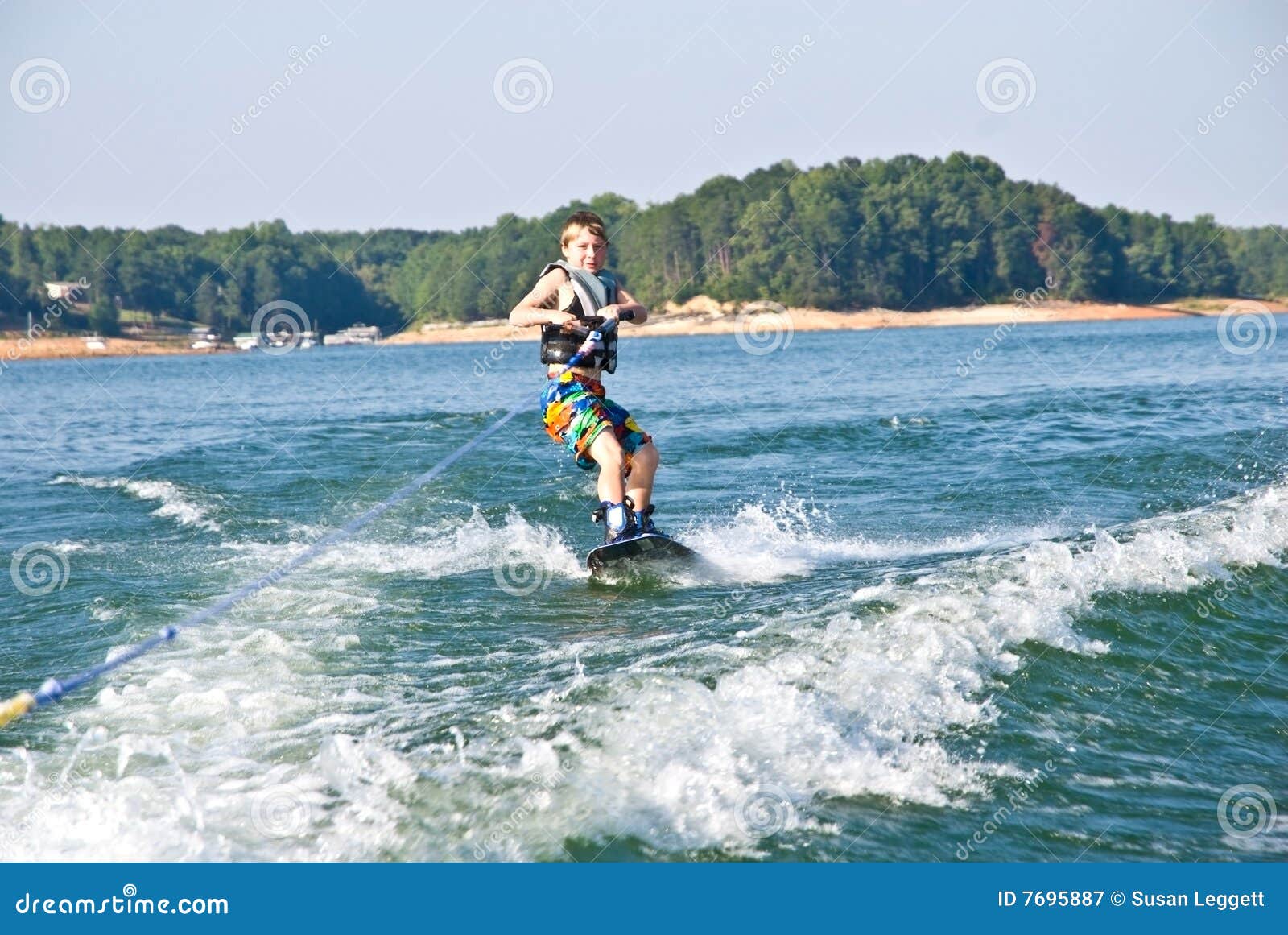 Young Boy on Wakeboard stock image. Image of active, rope - 7695887