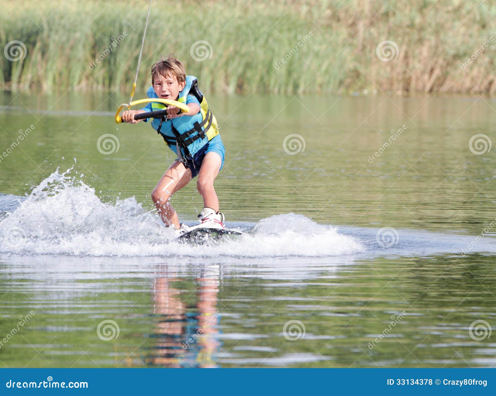 Young boy wakeboarding stock photo. Image of boating - 33134378