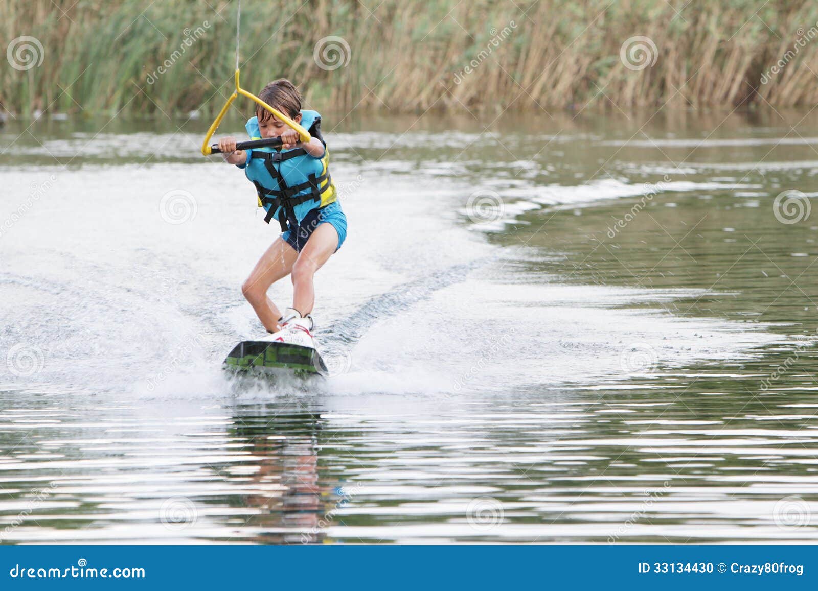 Young boy wakeboarding stock photo. Image of boarding - 33134430