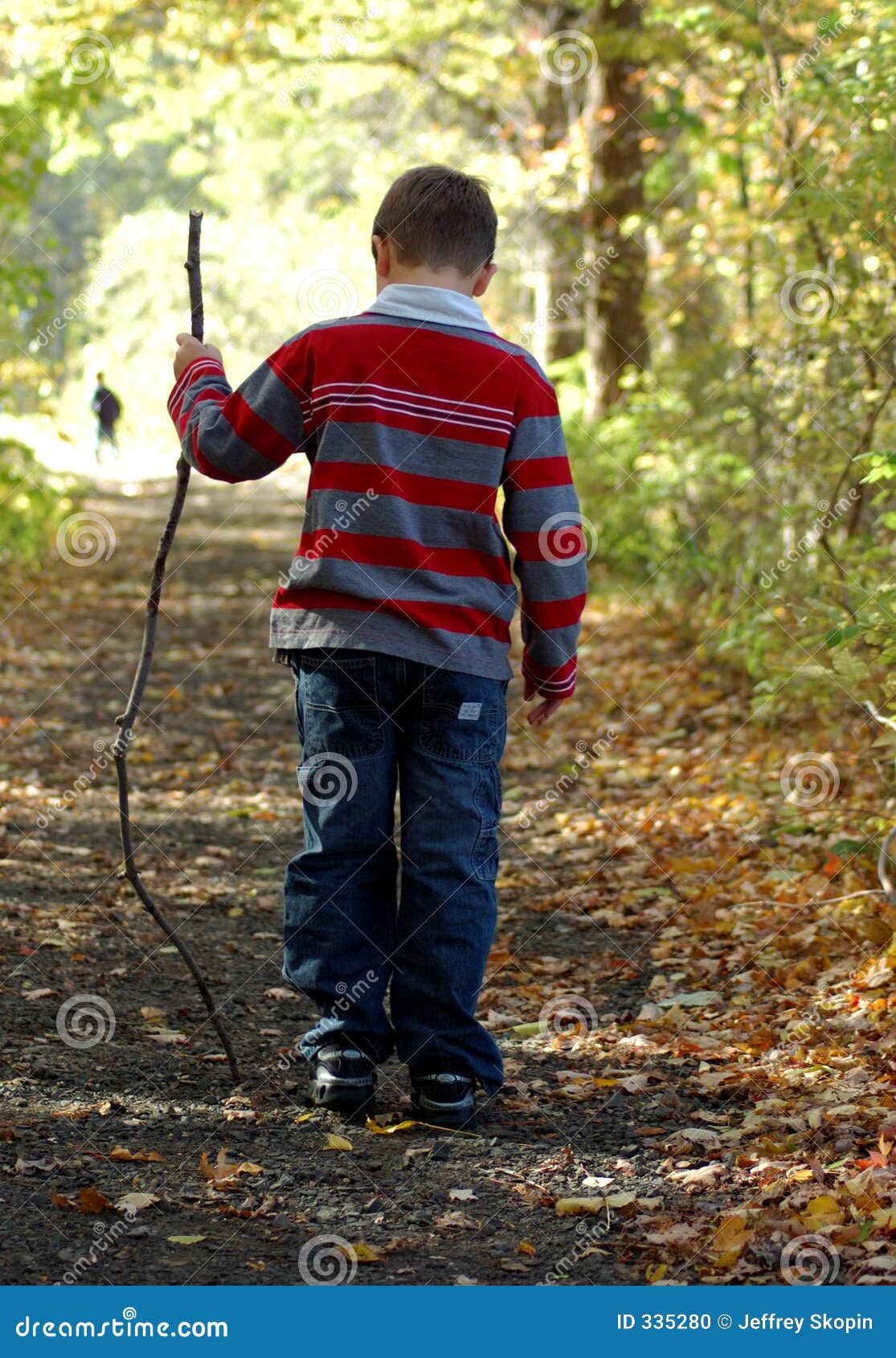 Young Boy Walking with Stick Stock Photo - Image of stripes, fall: 335280