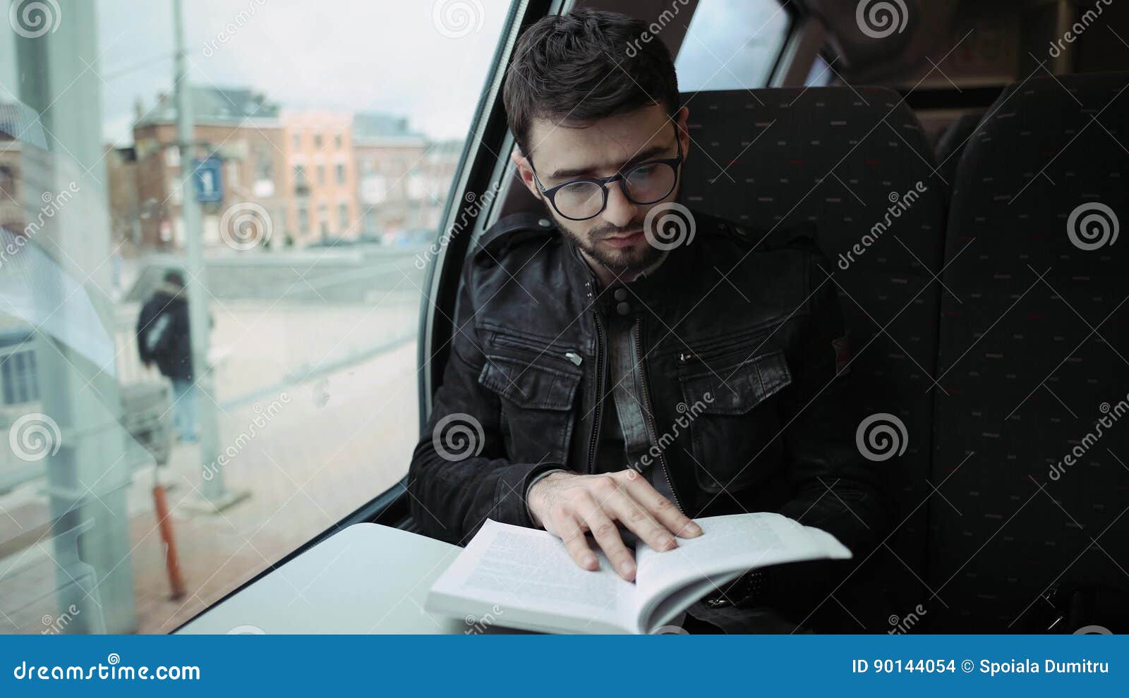 A Young Boy Walking on a Train, Reading a Book. Boy with Glasses. 4k ...