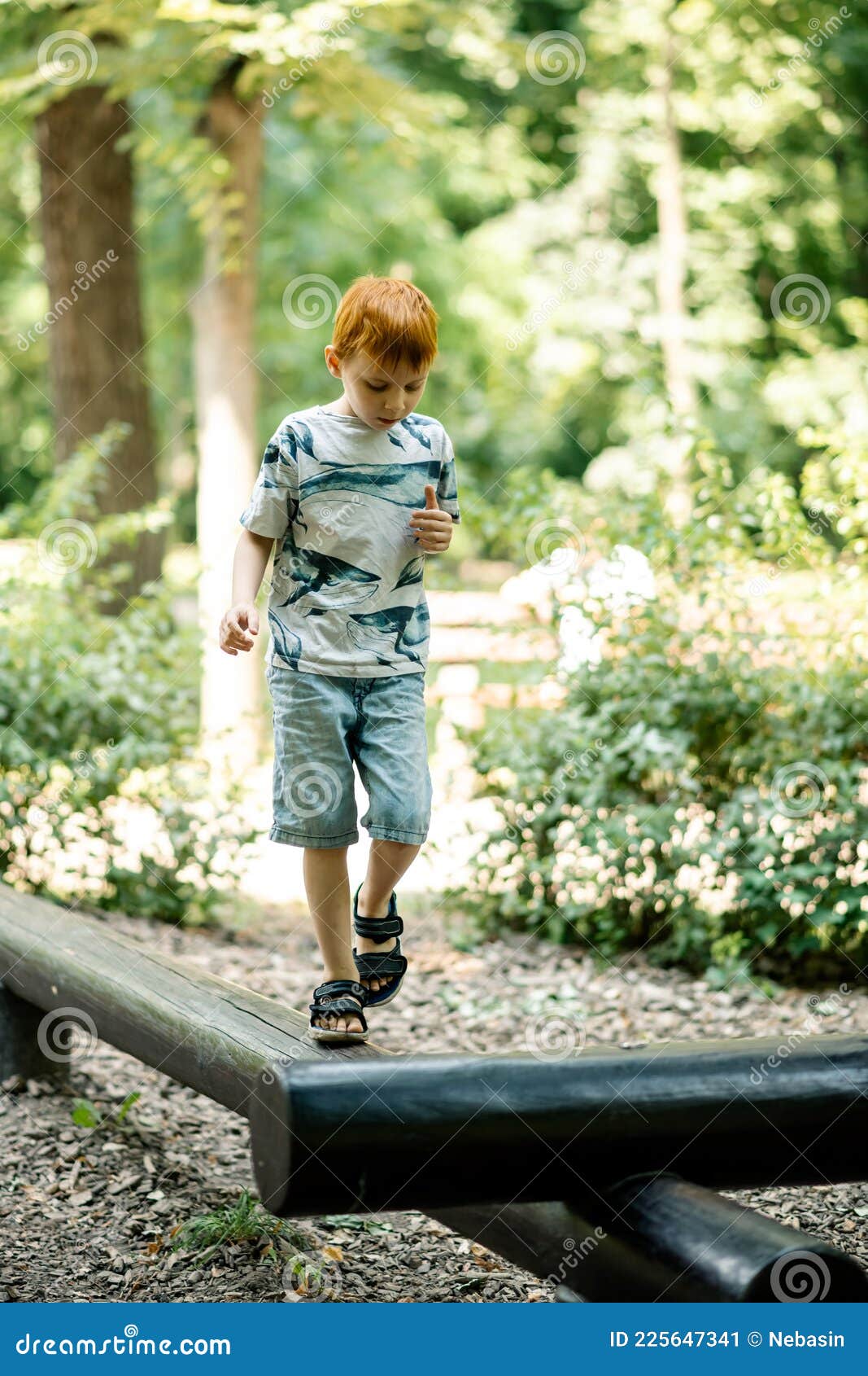 A Young Boy Walks on a Log at the Playground. Active Summer Vacation ...