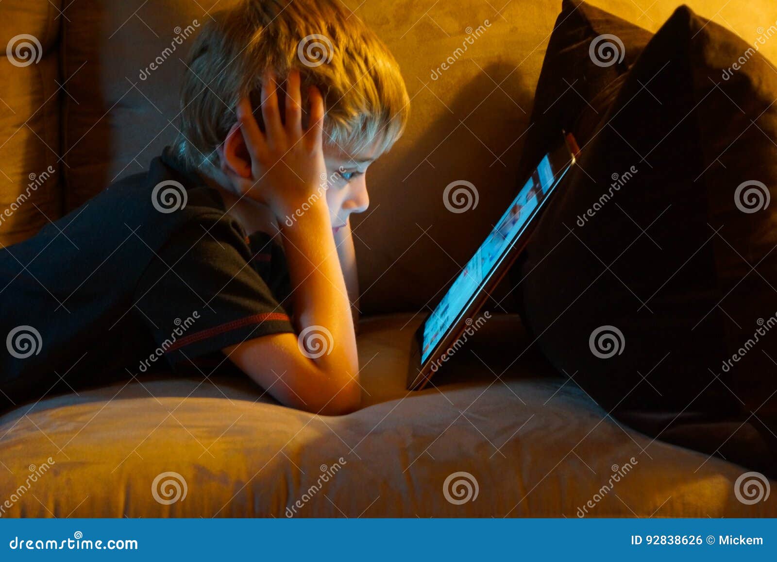 Young Boy Watching iPad stock photo. Image of school - 92838626