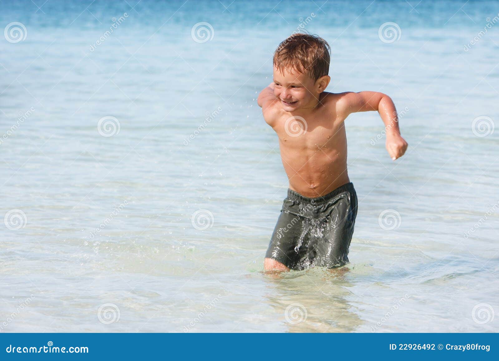 Young boy in water stock photo. Image of laugh, casual - 22926492