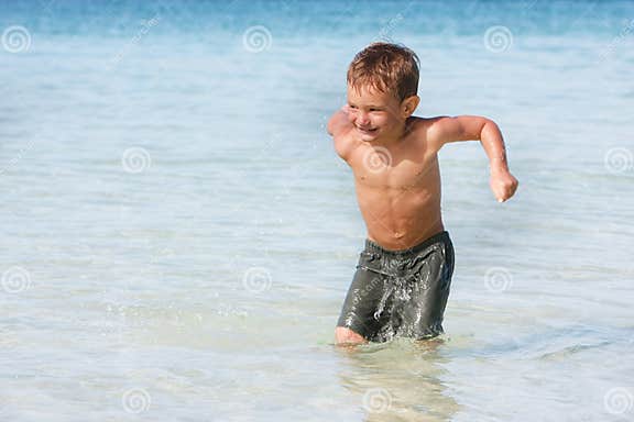 Young boy in water stock photo. Image of laugh, casual - 22926492
