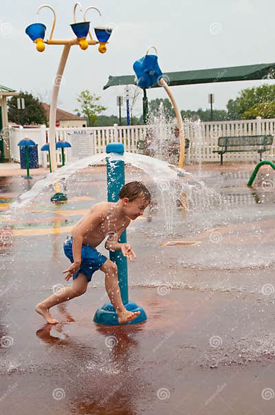 Young Boy at Water Park stock photo. Image of summer - 15651364