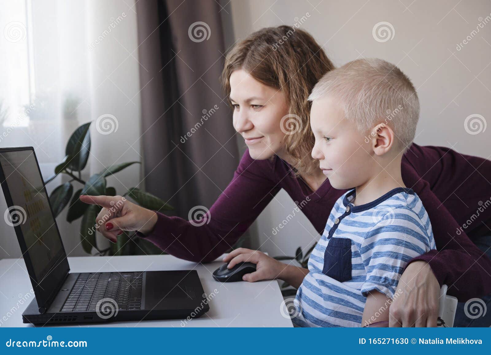 Boy Working on a Computer Together with His Mom at Home. E-lessons ...