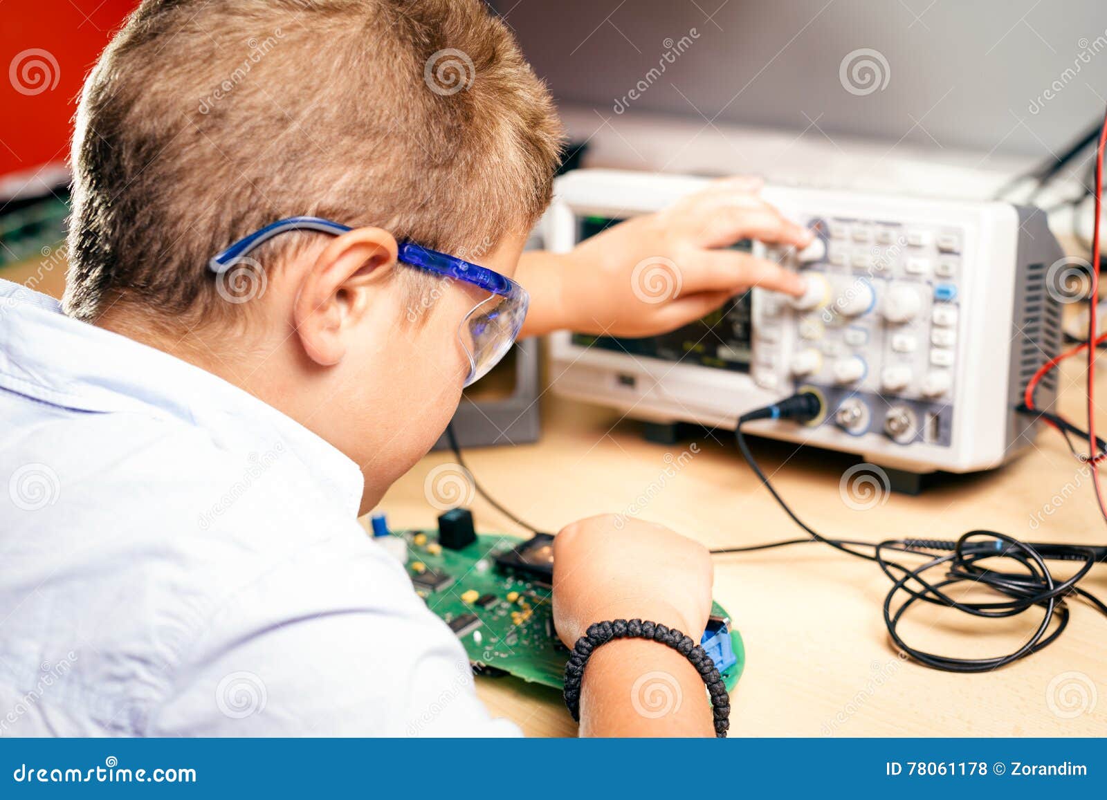 Young Boy Working on an Electronics Project Stock Photo - Image of ...