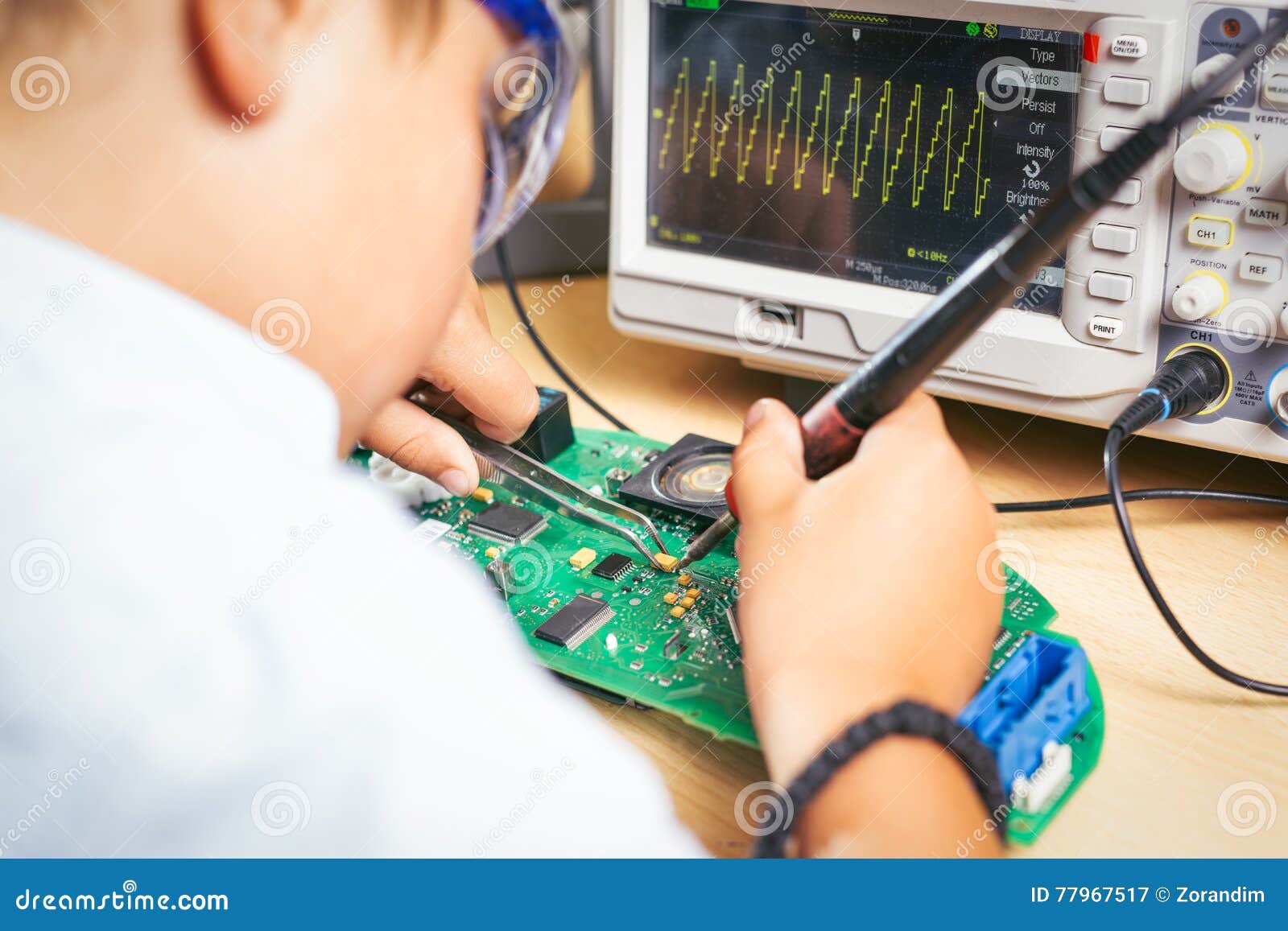 Young Boy Working on an Electronics Project Stock Image - Image of ...