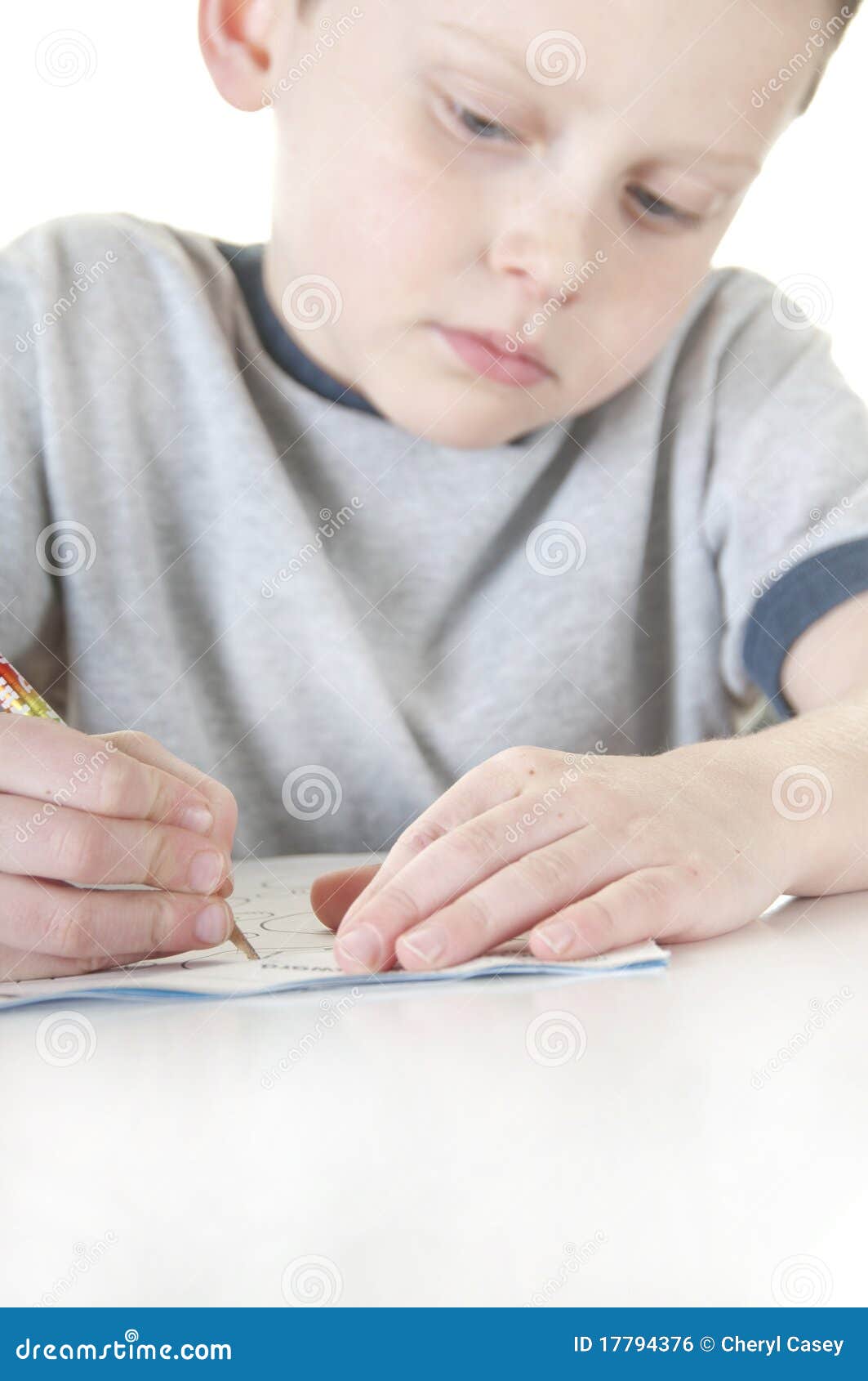 Young Boy Working at School Stock Photo - Image of cute, confused: 17794376