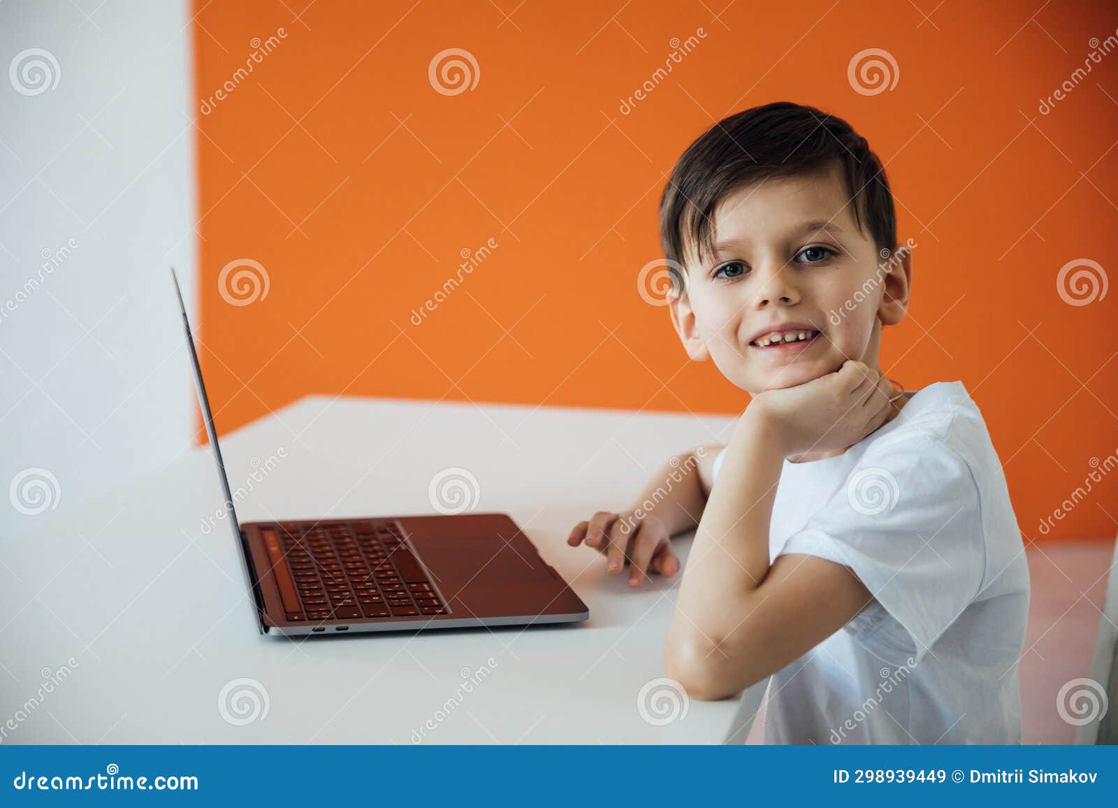 Smart Young Boy Works on a Laptop for His New Project in His Computer ...