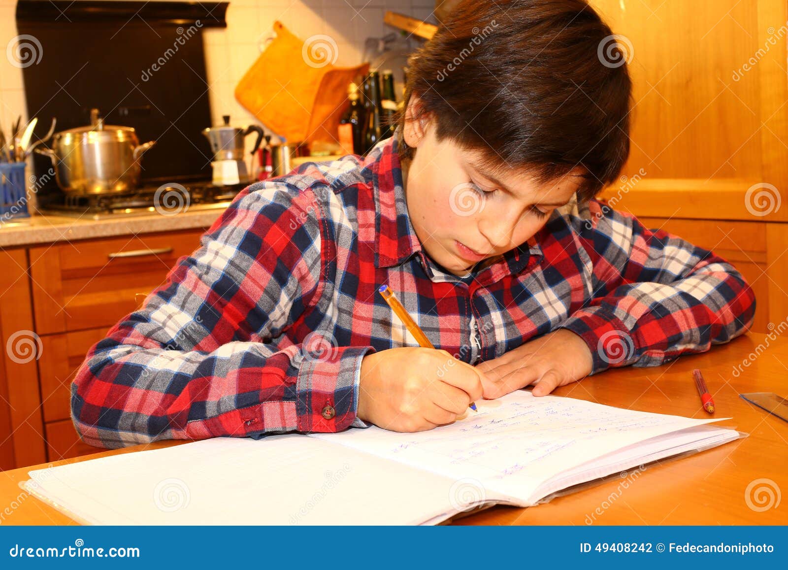 Young Boy Writes on His Notebook Stock Photo - Image of learn, book ...