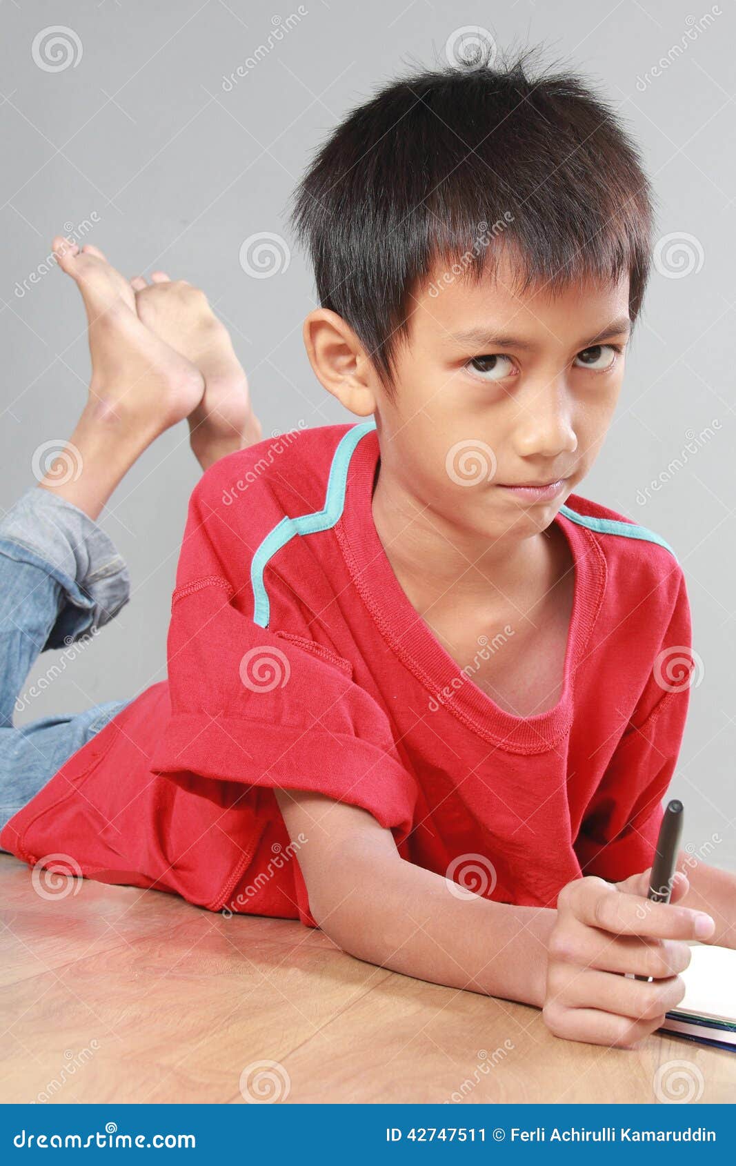 Young Boy Writing on the Floor Stock Image - Image of schoolboy ...