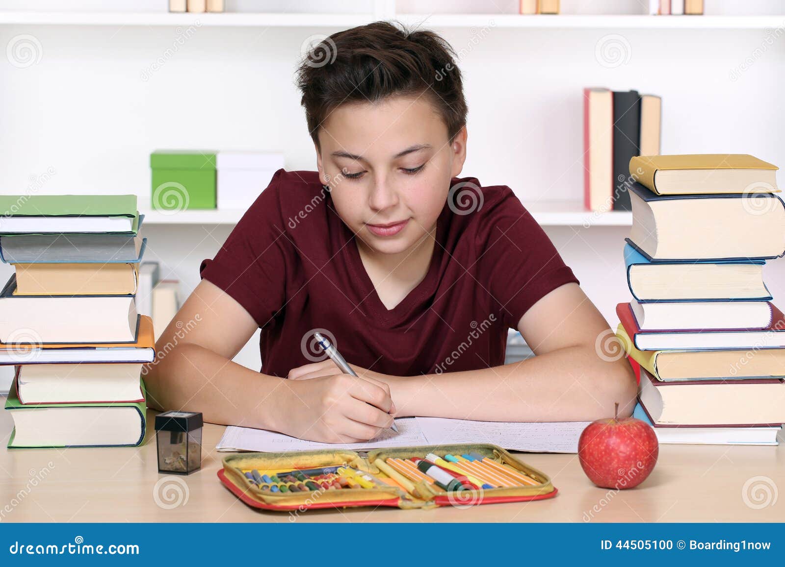 Young Boy Writing His Homework at School Stock Photo - Image of ...