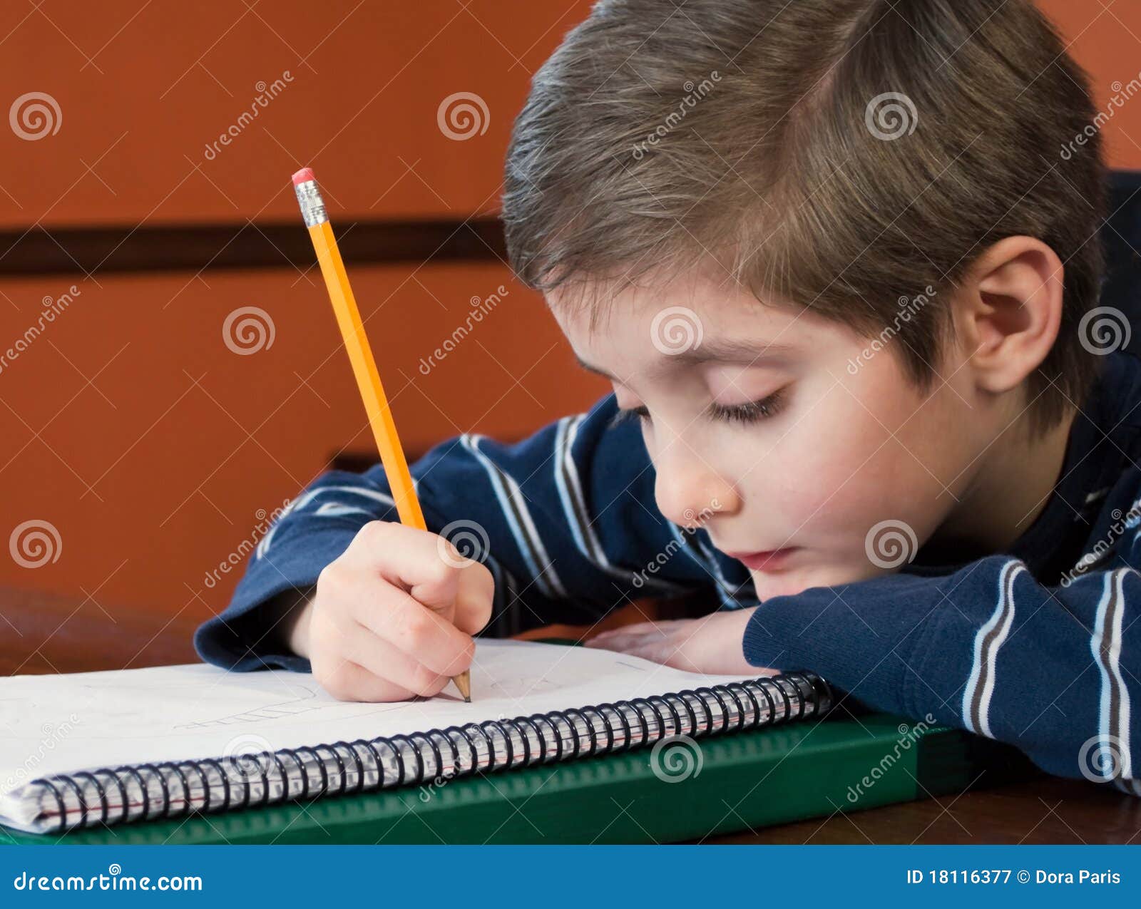 Young Boy Writing in Notebook Stock Image - Image of homework, notebook ...
