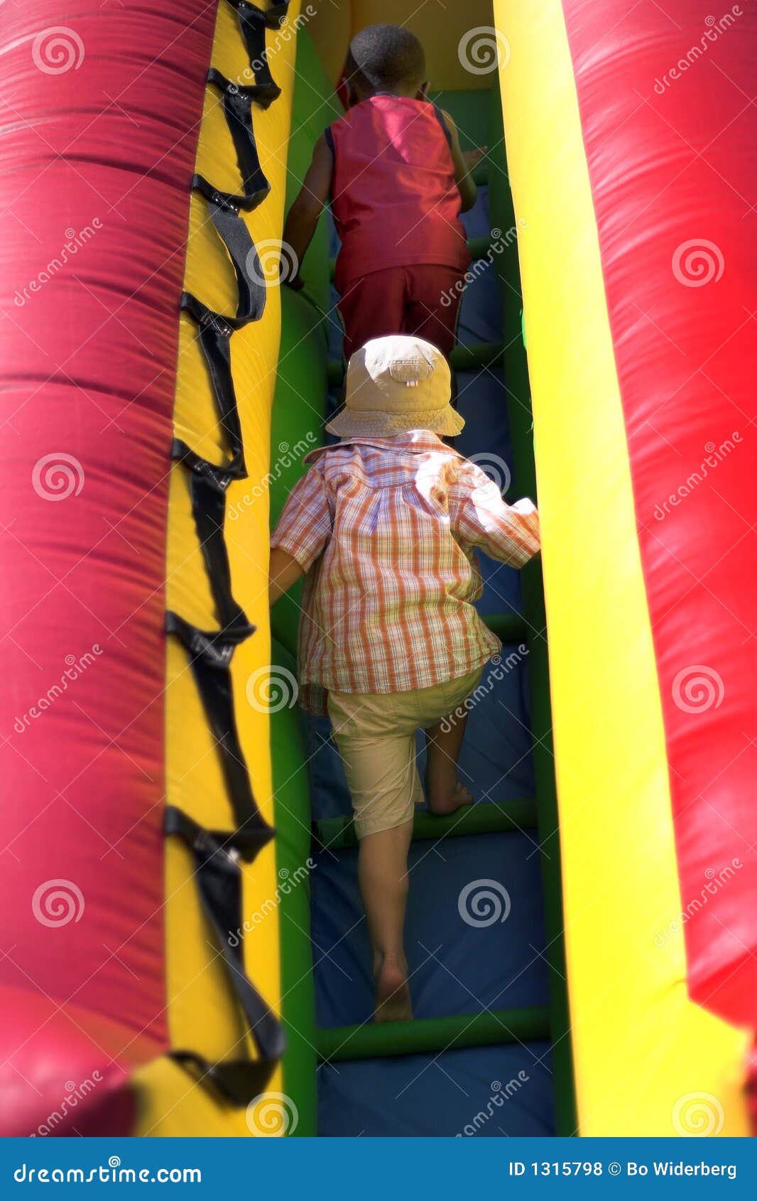 Young Boys Climbing Inflatable Bouncy Stock Photo - Image of together ...