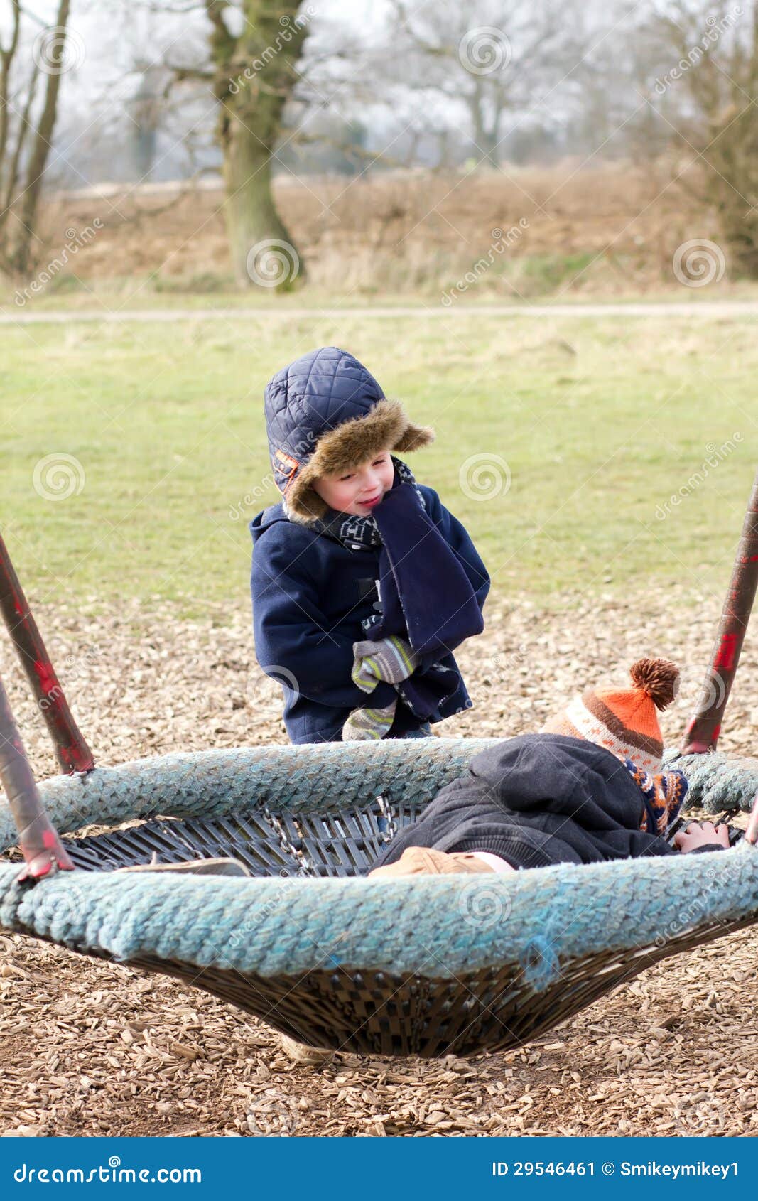 Young Boys Playing at the Park on a Cold Day Stock Image - Image of ...