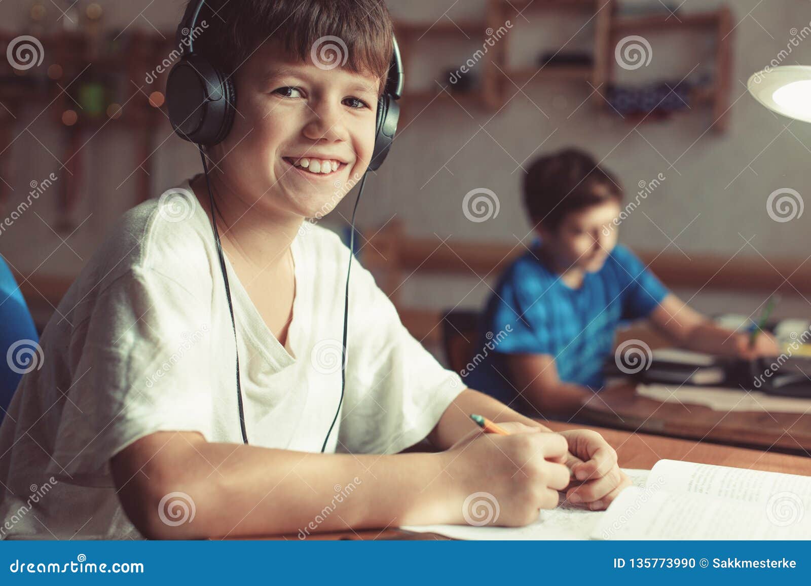 Young Boys Smiling and Doing Homework at Home Stock Photo - Image of ...