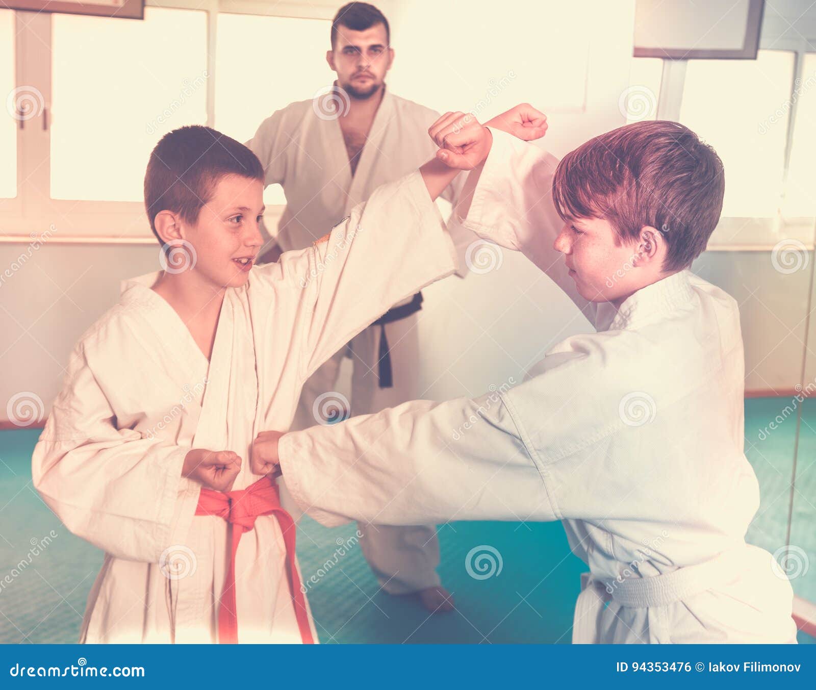 Young Boys Training in Pair Stock Photo - Image of observing, health ...