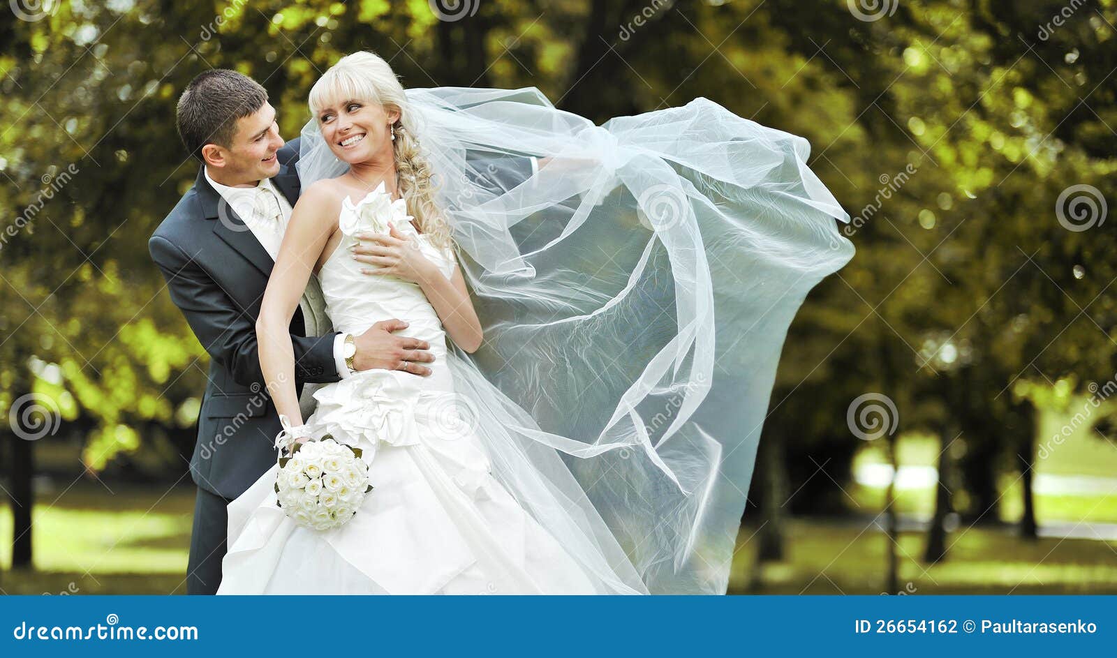 Young Bride and Groom Laughing and Looking To Each Other Stock Photo ...