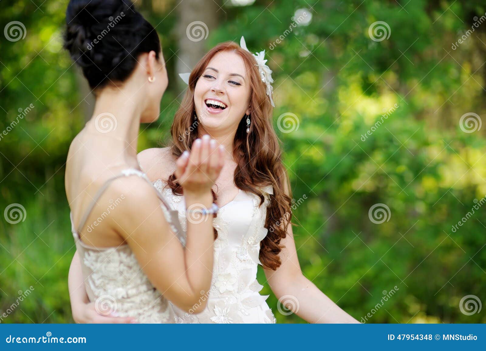 Young Bride and Her Bridesmaid Hugging Stock Photo - Image of female ...