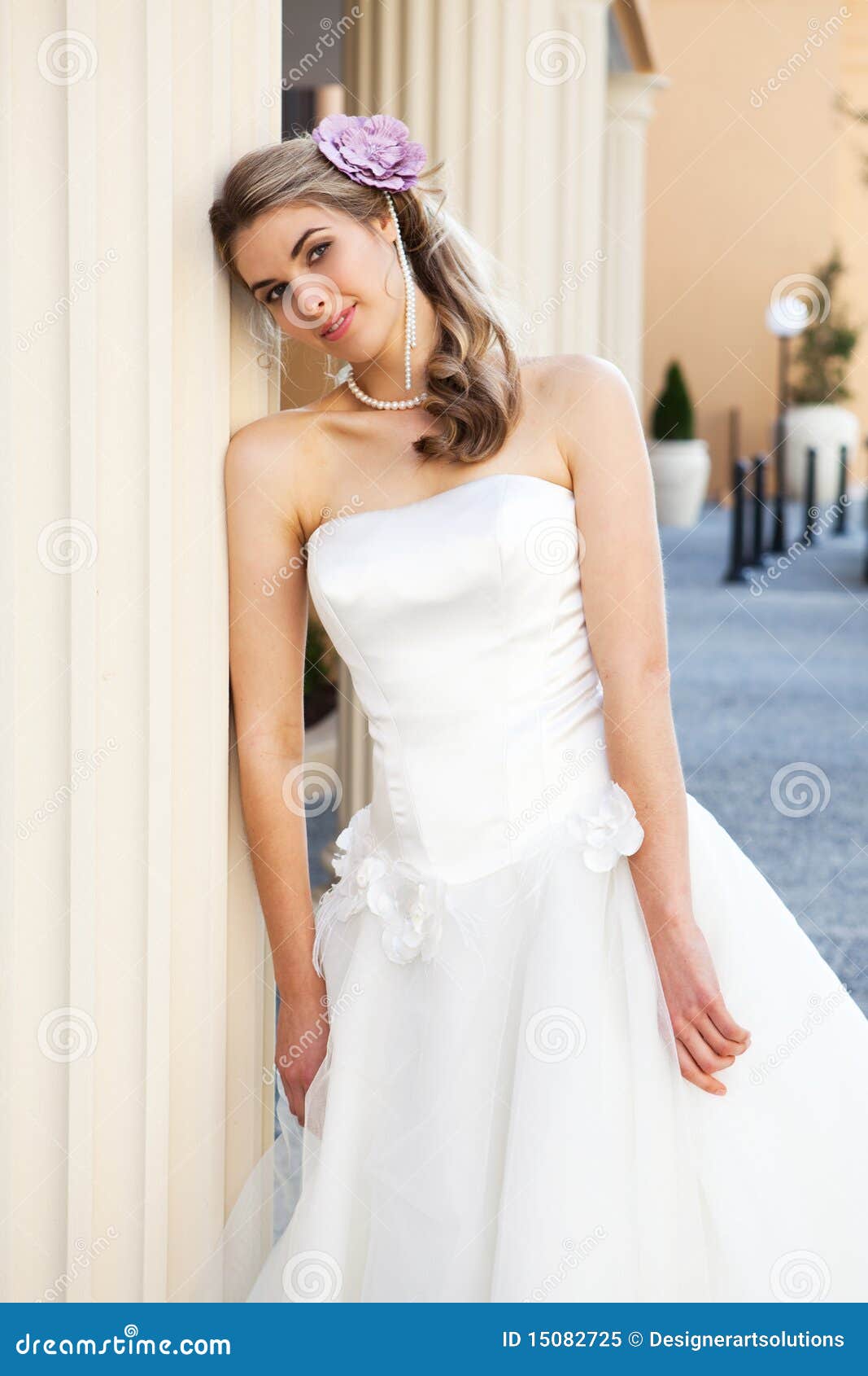 Young Bride Leaning Against a Pillar Stock Image - Image of dress ...