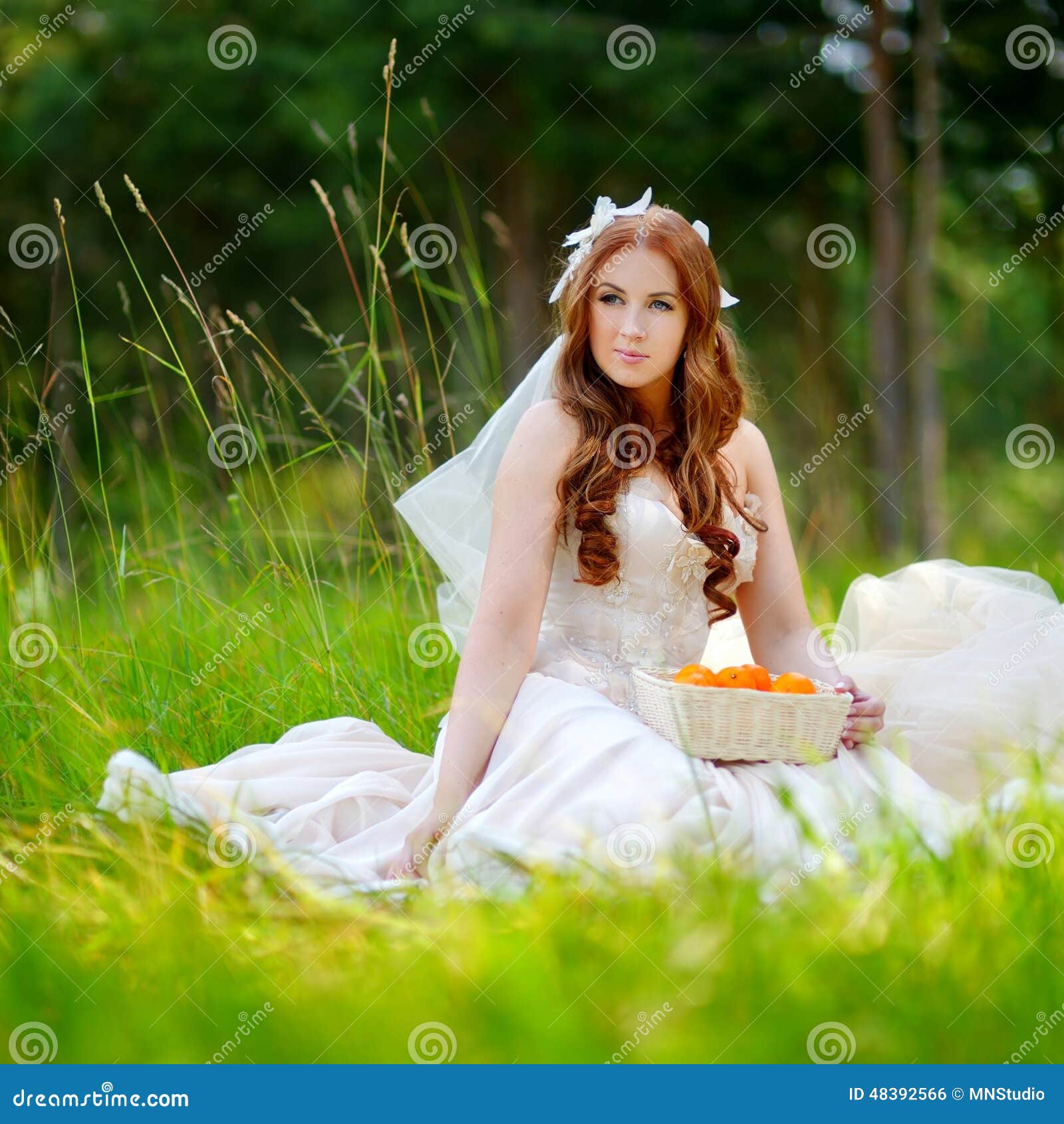Young Bride Sitting on a Grass Stock Photo - Image of mandarin, adult ...