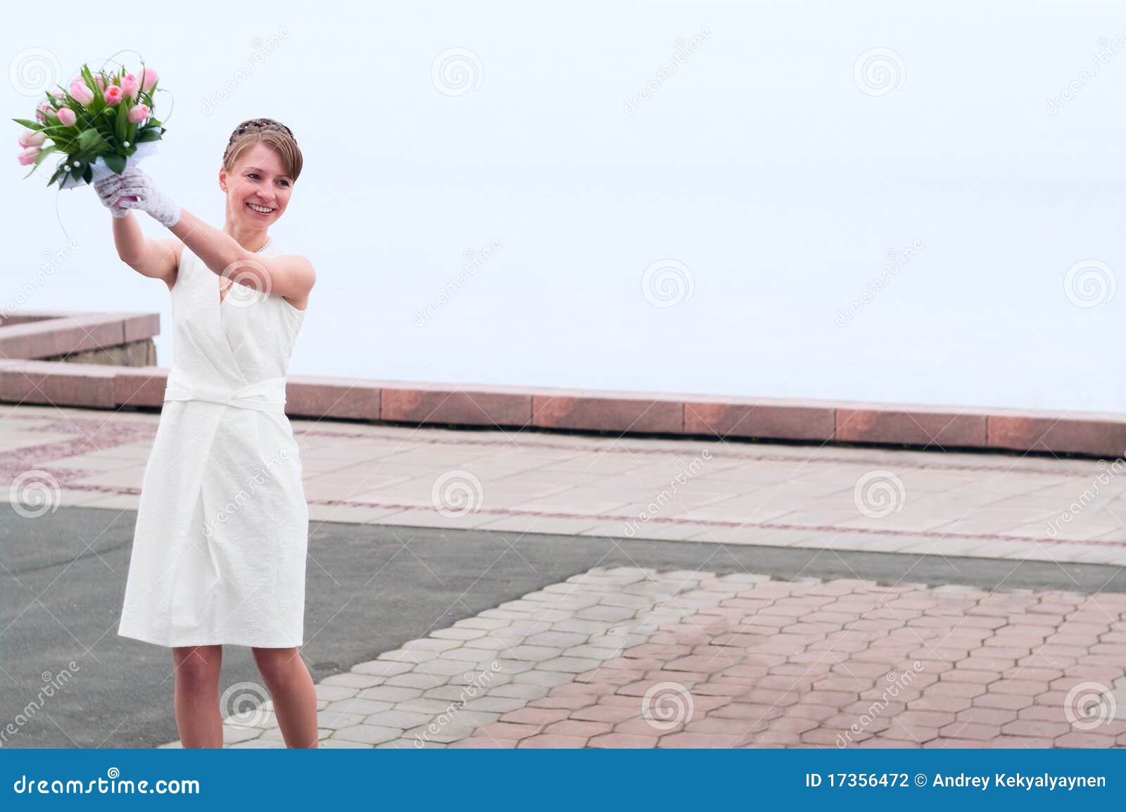 Young Bride Throwing Flowers Stock Photo - Image of hurl, caucasian ...