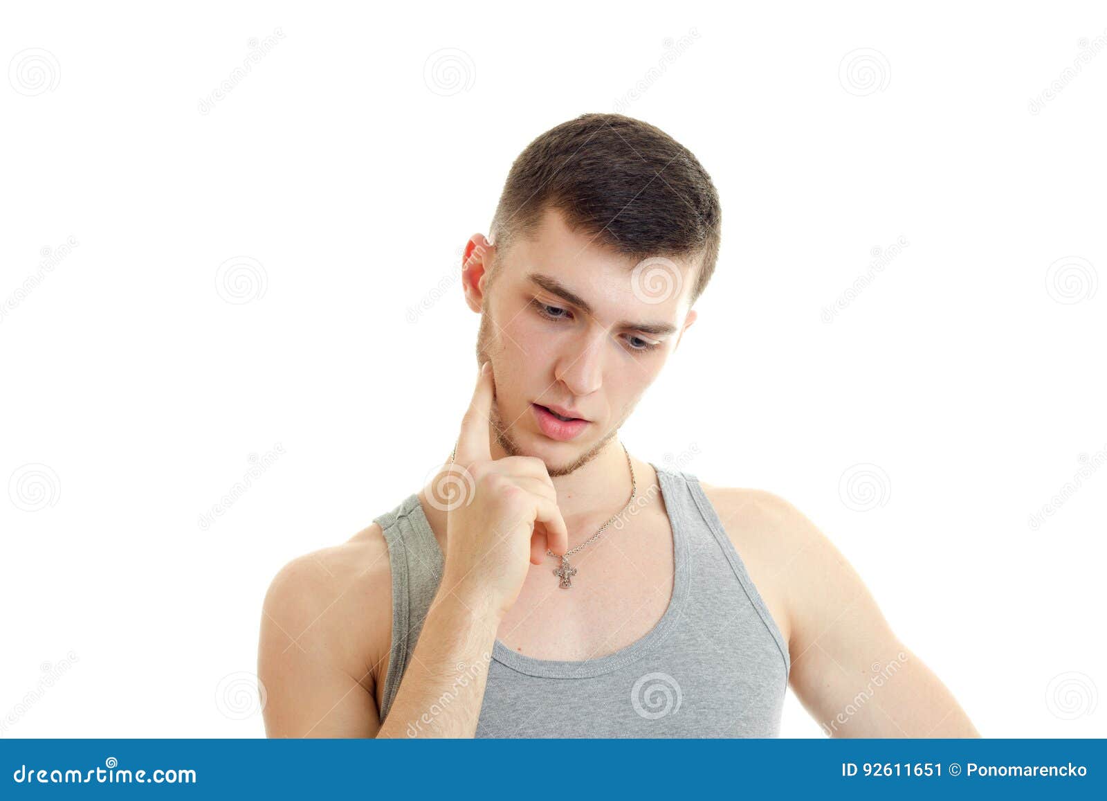 Young Brooding Guy Looks Down and Keeps the Finger Near the Cheeks ...