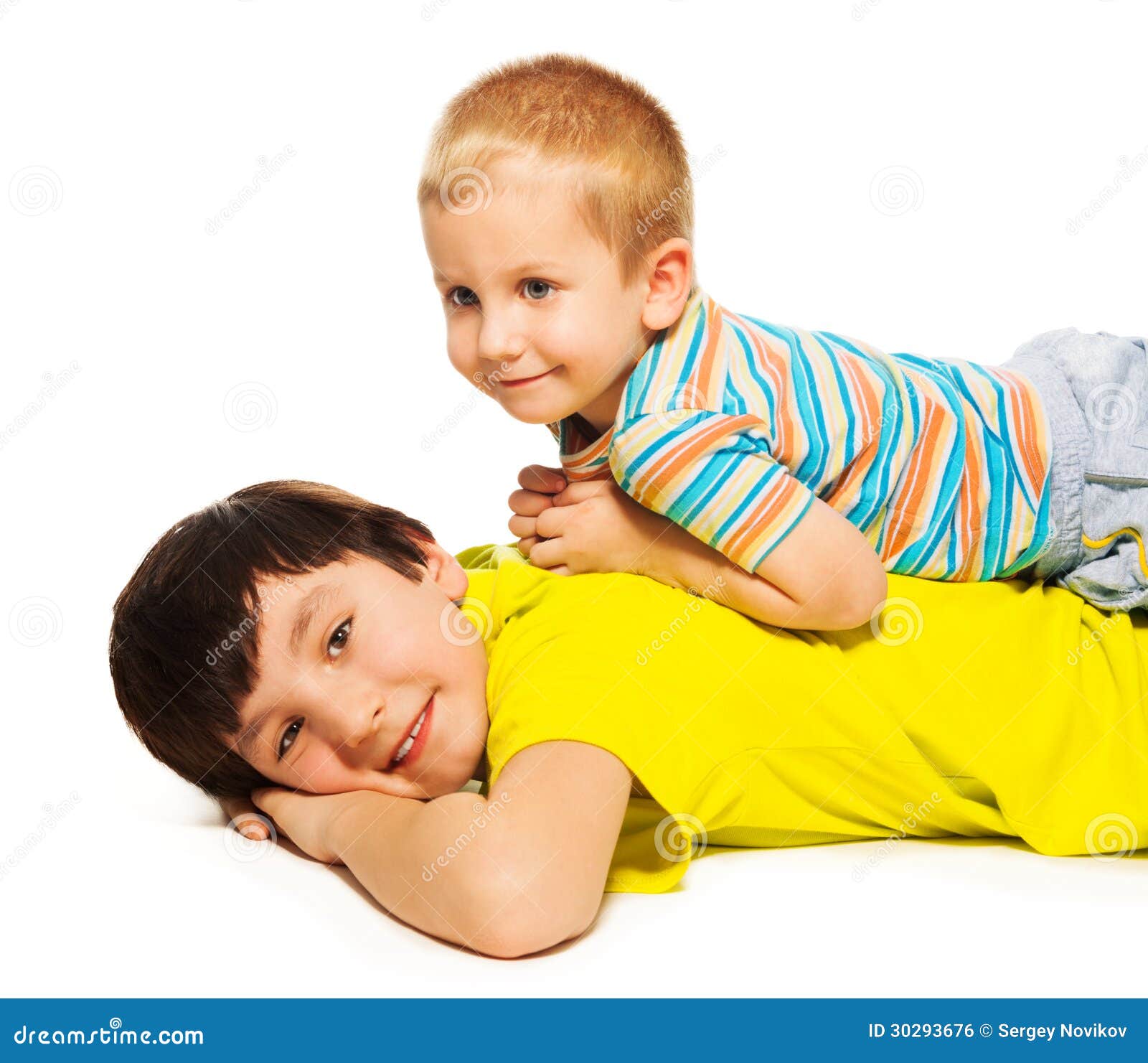 Young Brother Laying on the Back of Bigger Stock Photo - Image of ...