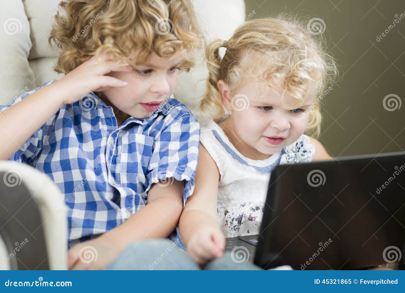 Young Brother And Sister Using Their Computer Laptop Together Stock ...
