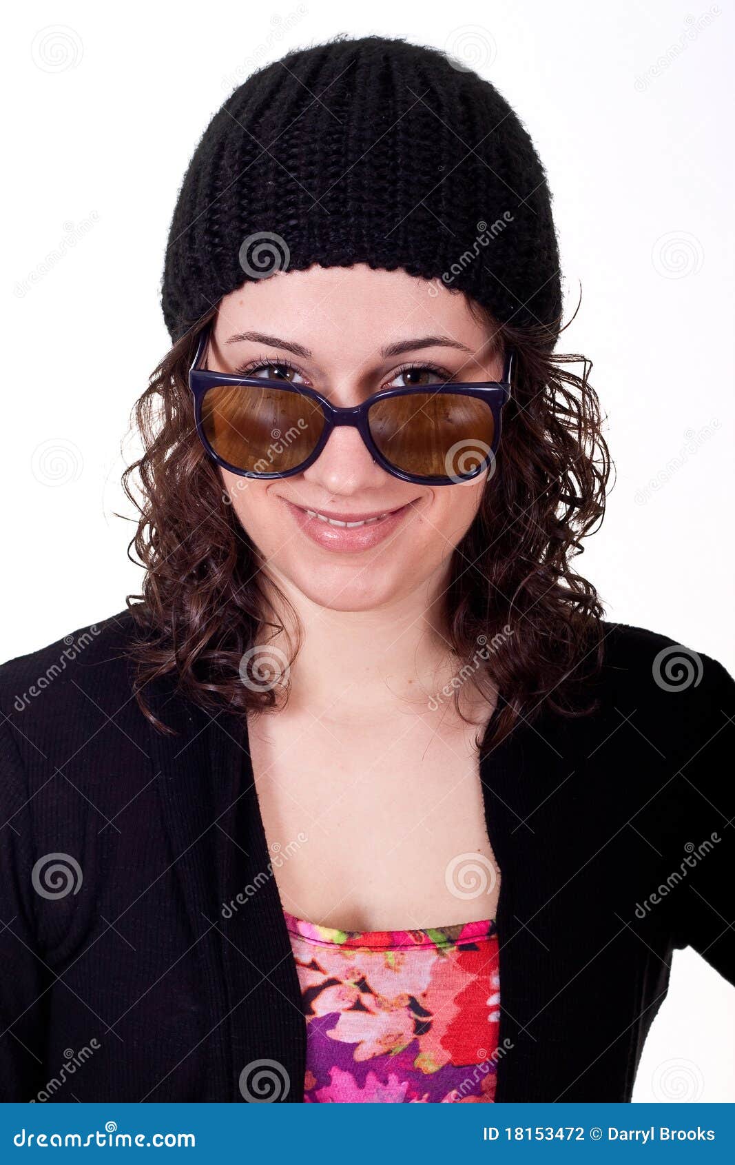 Young Brunette in Cap Looking Over Sunglasses Stock Photo - Image of ...