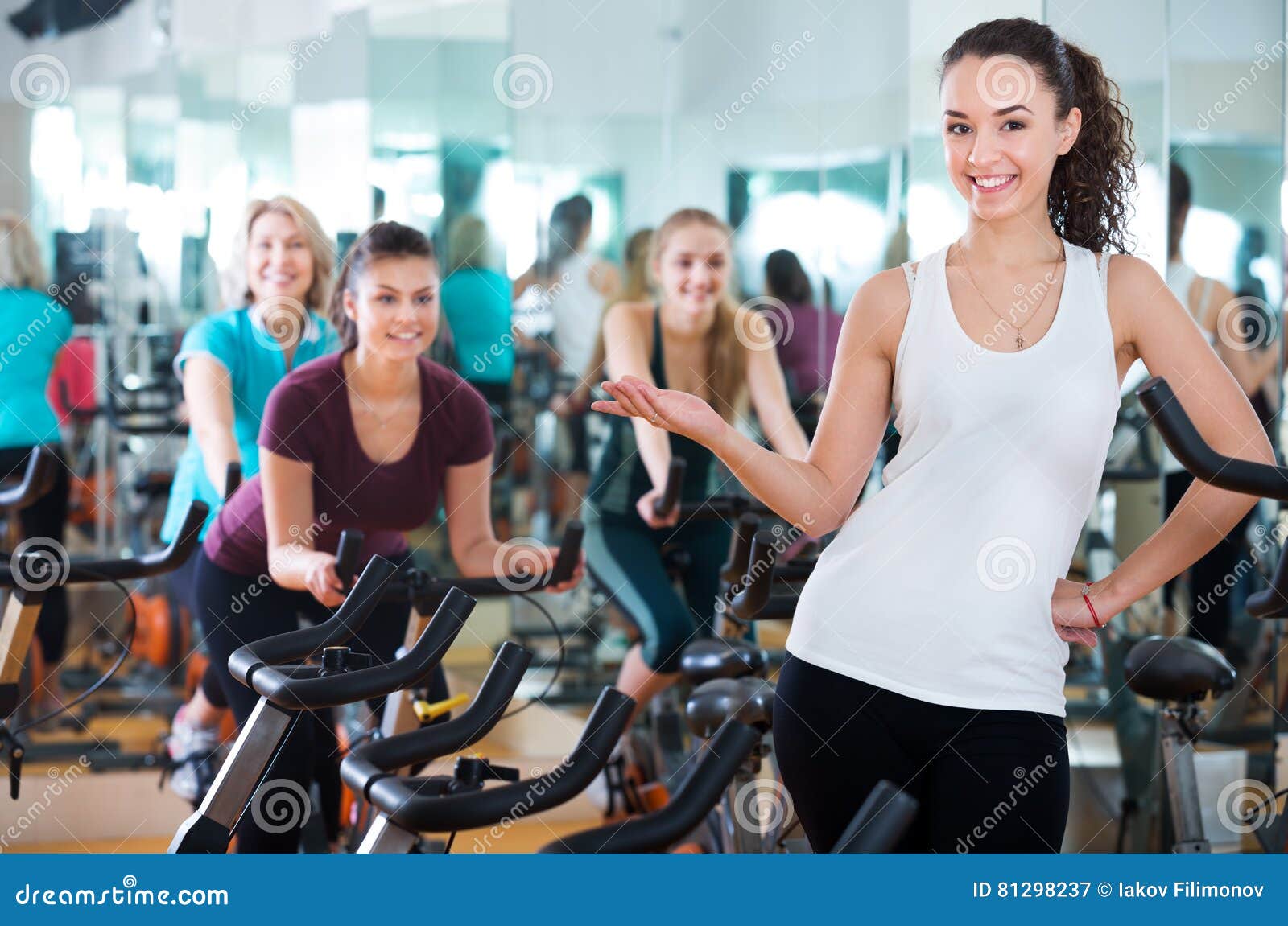 Young Brunette in Exercise Bikes Class Stock Image - Image of exercise ...