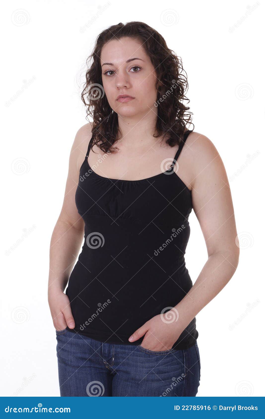 Young Brunette Looking Glum with Hands in Pockets Stock Photo - Image ...