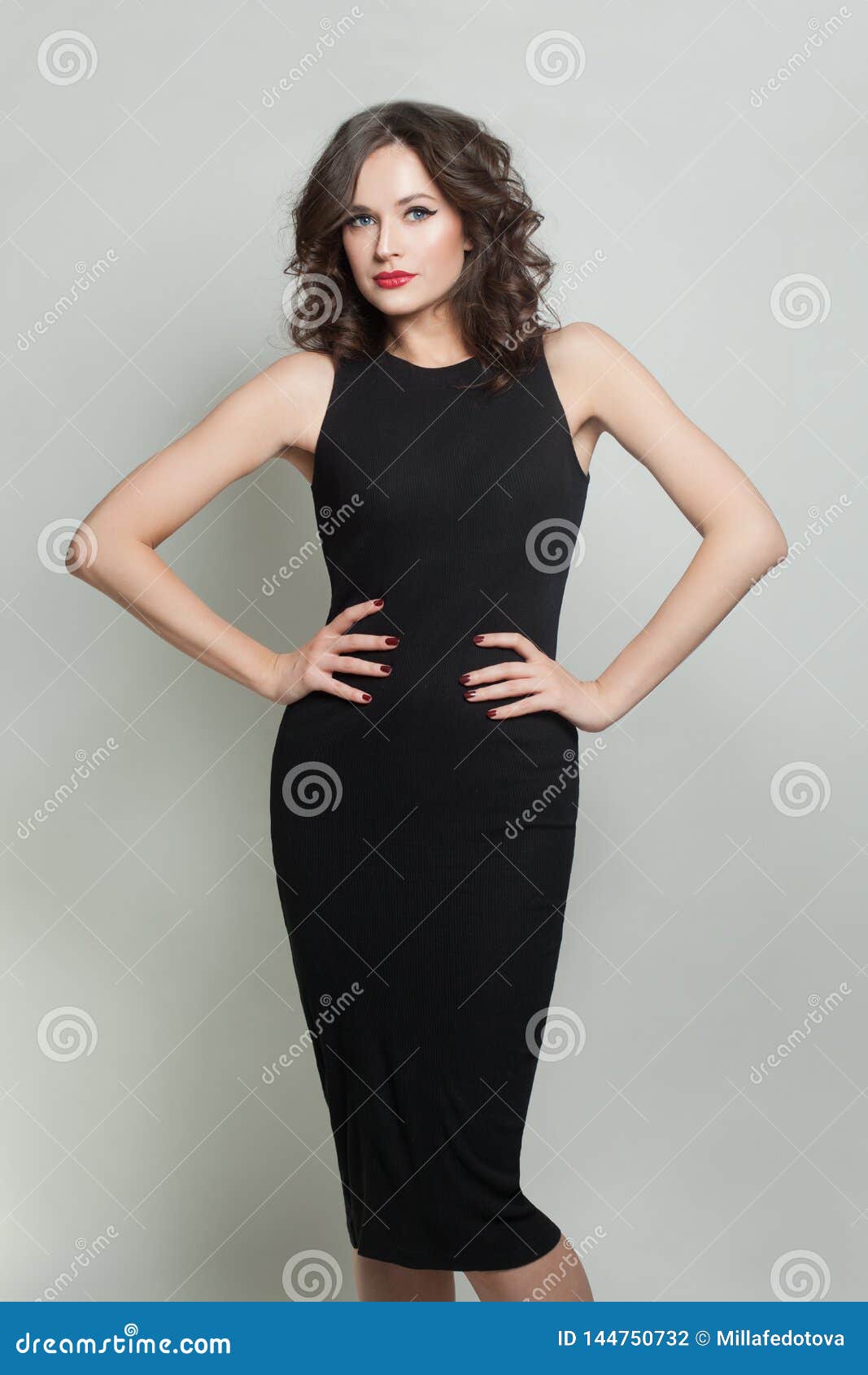 Young Brunette Model Woman Wearing Black Dress Standing On White