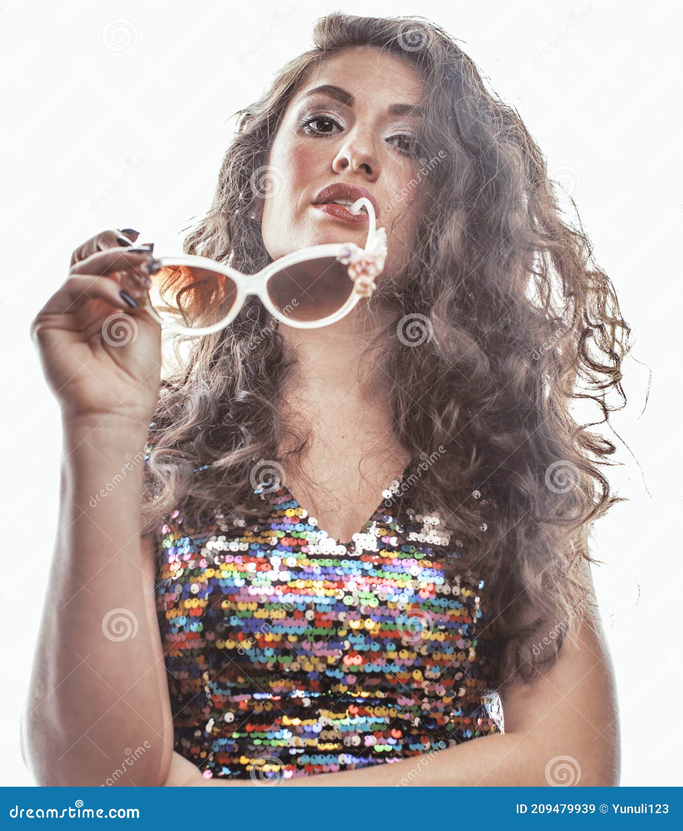 Young Brunette Woman With Curly Hairstyle In Fancy Glamur Dress