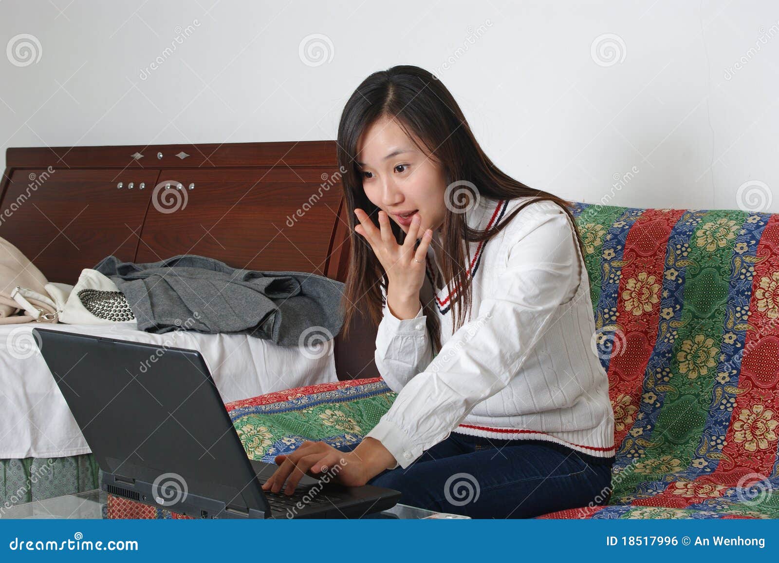 Young Brunette Woman Finds Surprise on Computer Stock Photo - Image of ...