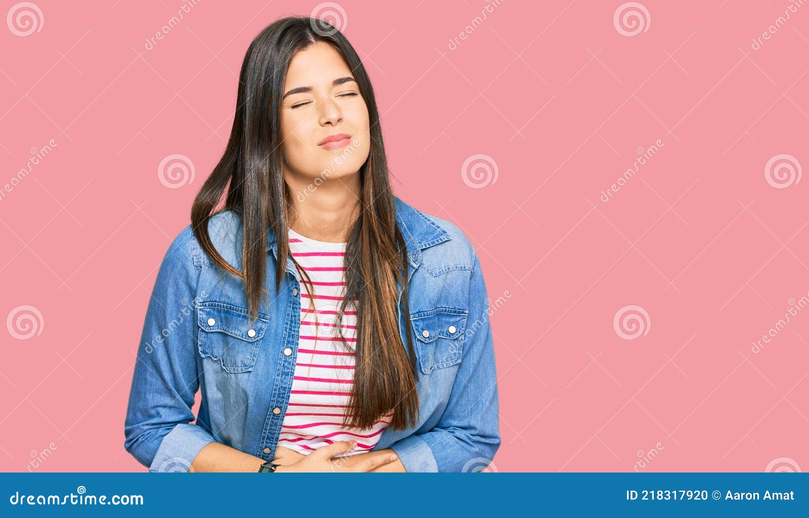 Young Brunette Woman Wearing Casual Clothes With Hand On Stomach