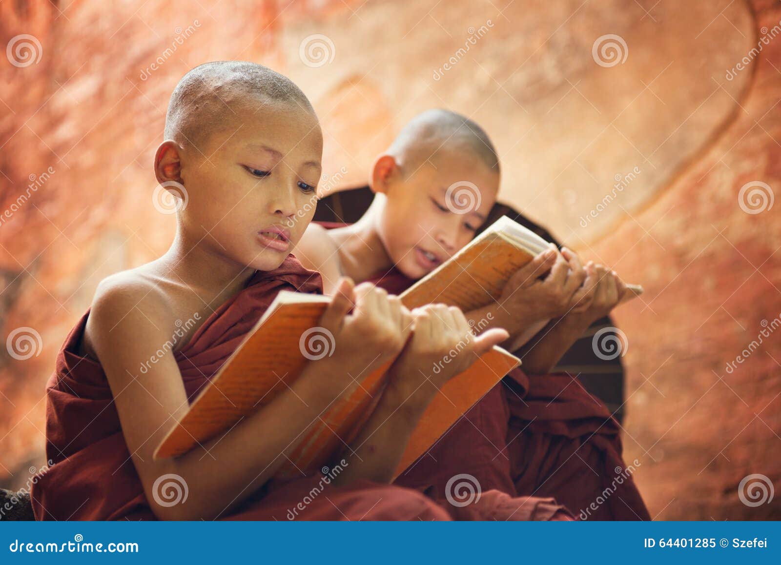 Young Buddhist Novice Monks Reading Outside Temple Stock Image - Image ...