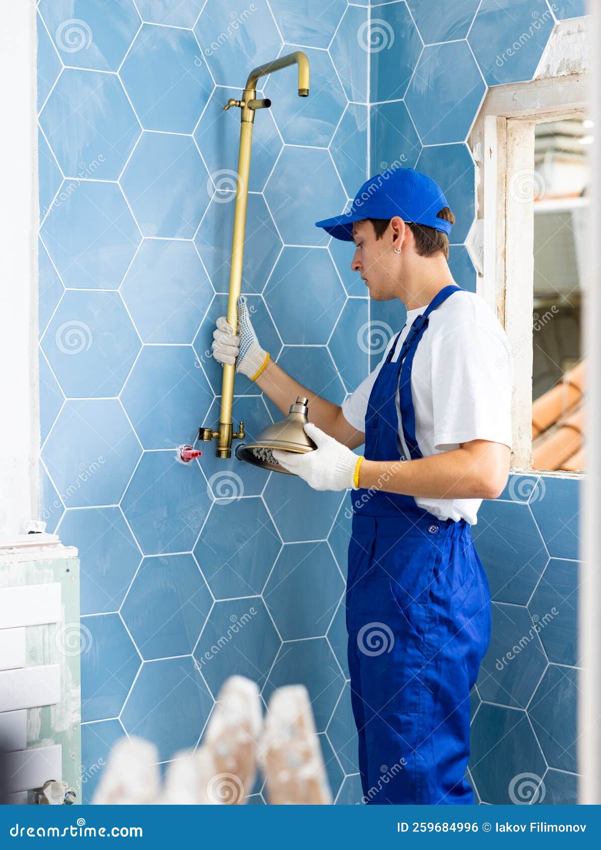 Young Builder Assembling Shower Set before Fixing To Wall Stock Photo ...