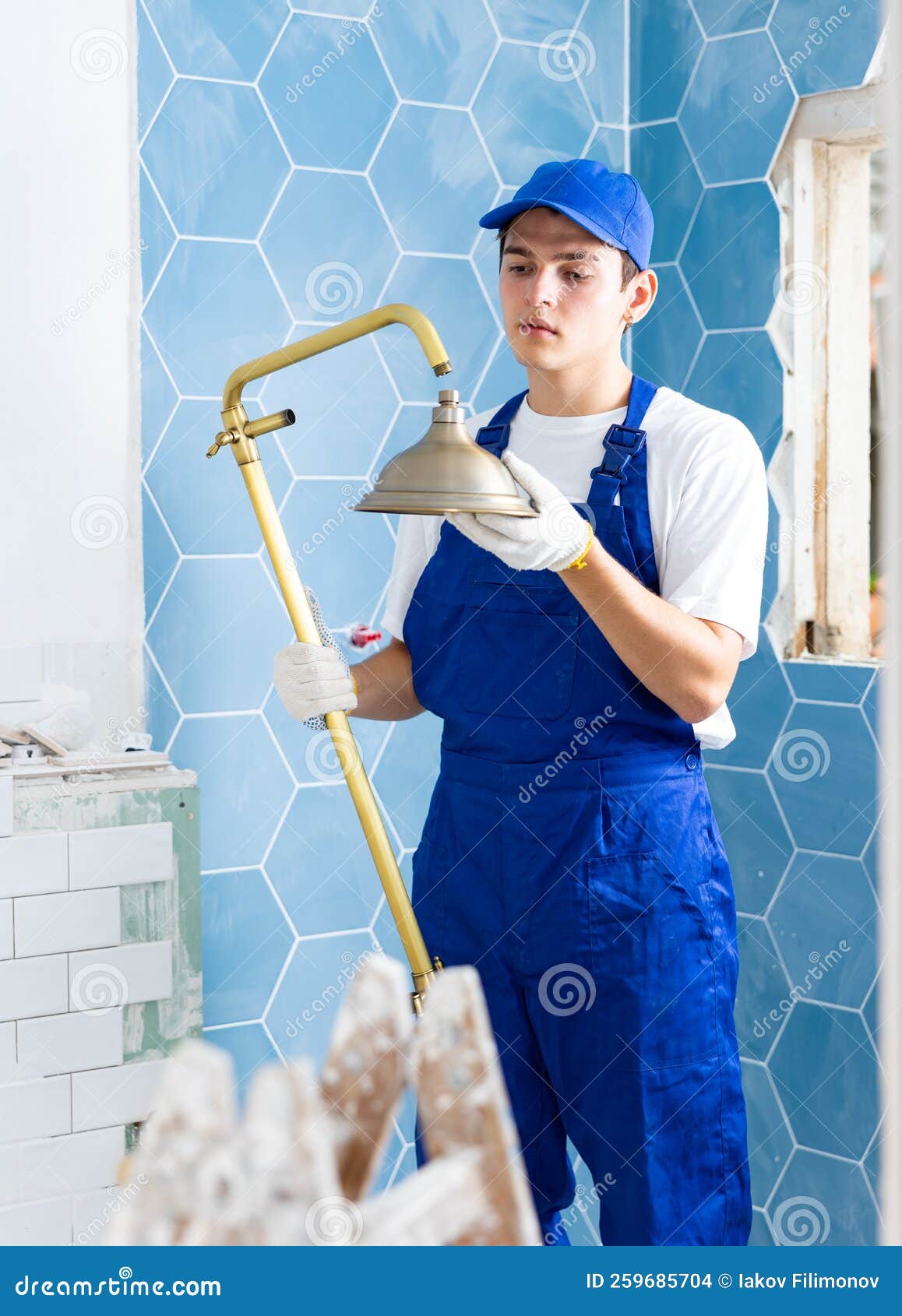 Young Builder Assembling Shower Set before Fixing To Wall Stock Photo ...