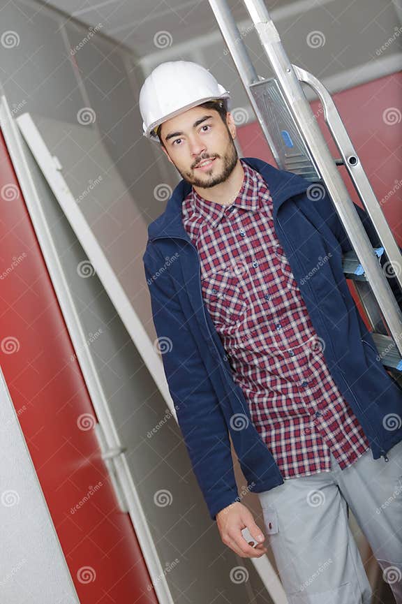 Young Builder Holding Ladder Stock Image - Image of labor, beginnings ...