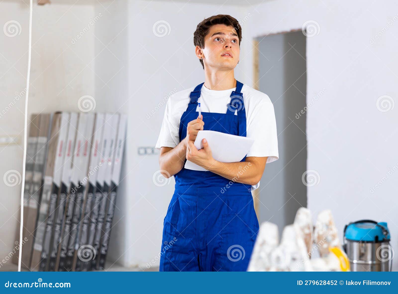 Young Builder Making Checklist while Planning Indoor Building Overhaul ...