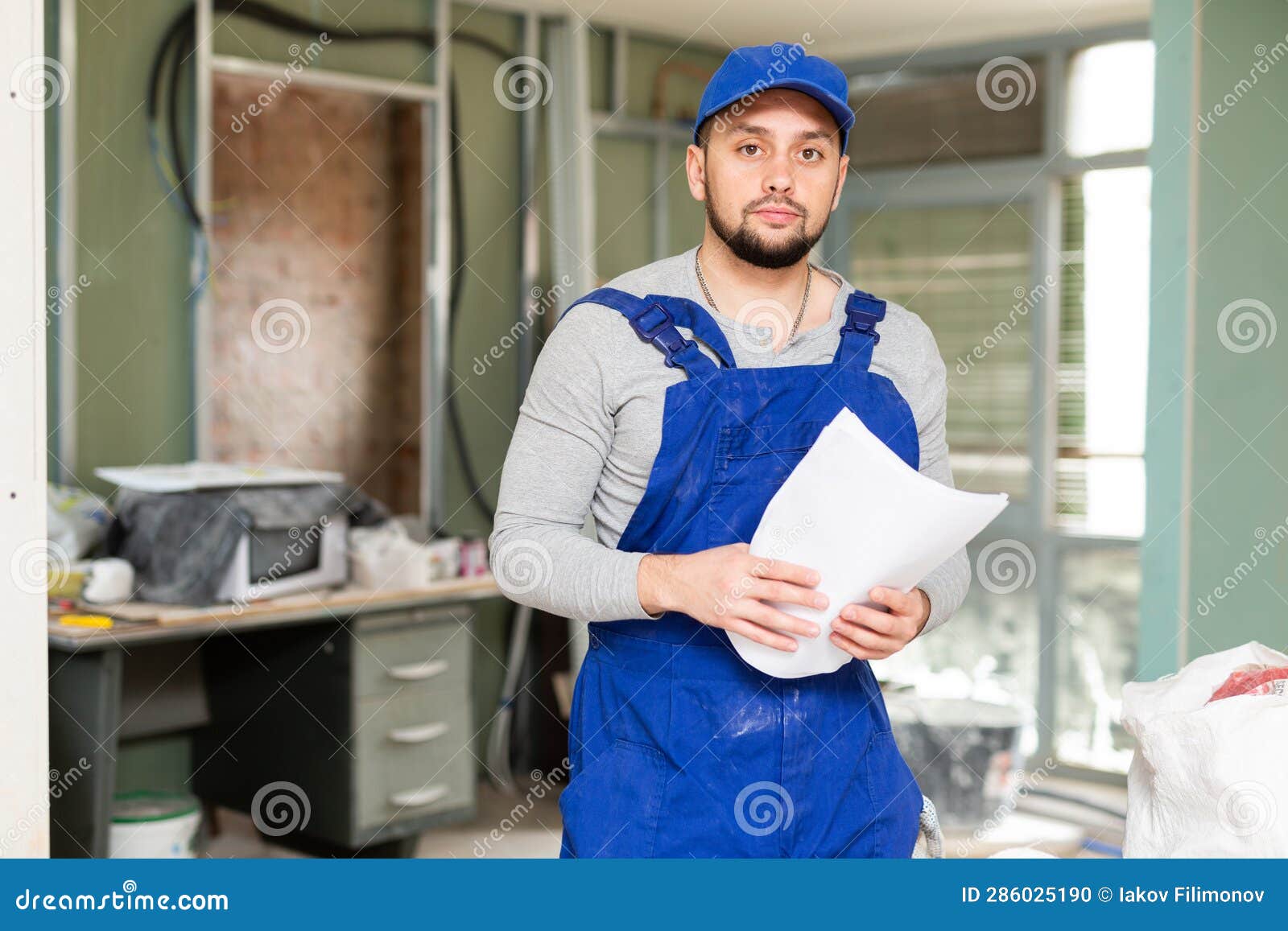 Young Builder is Studying the Construction Plan Stock Photo - Image of ...
