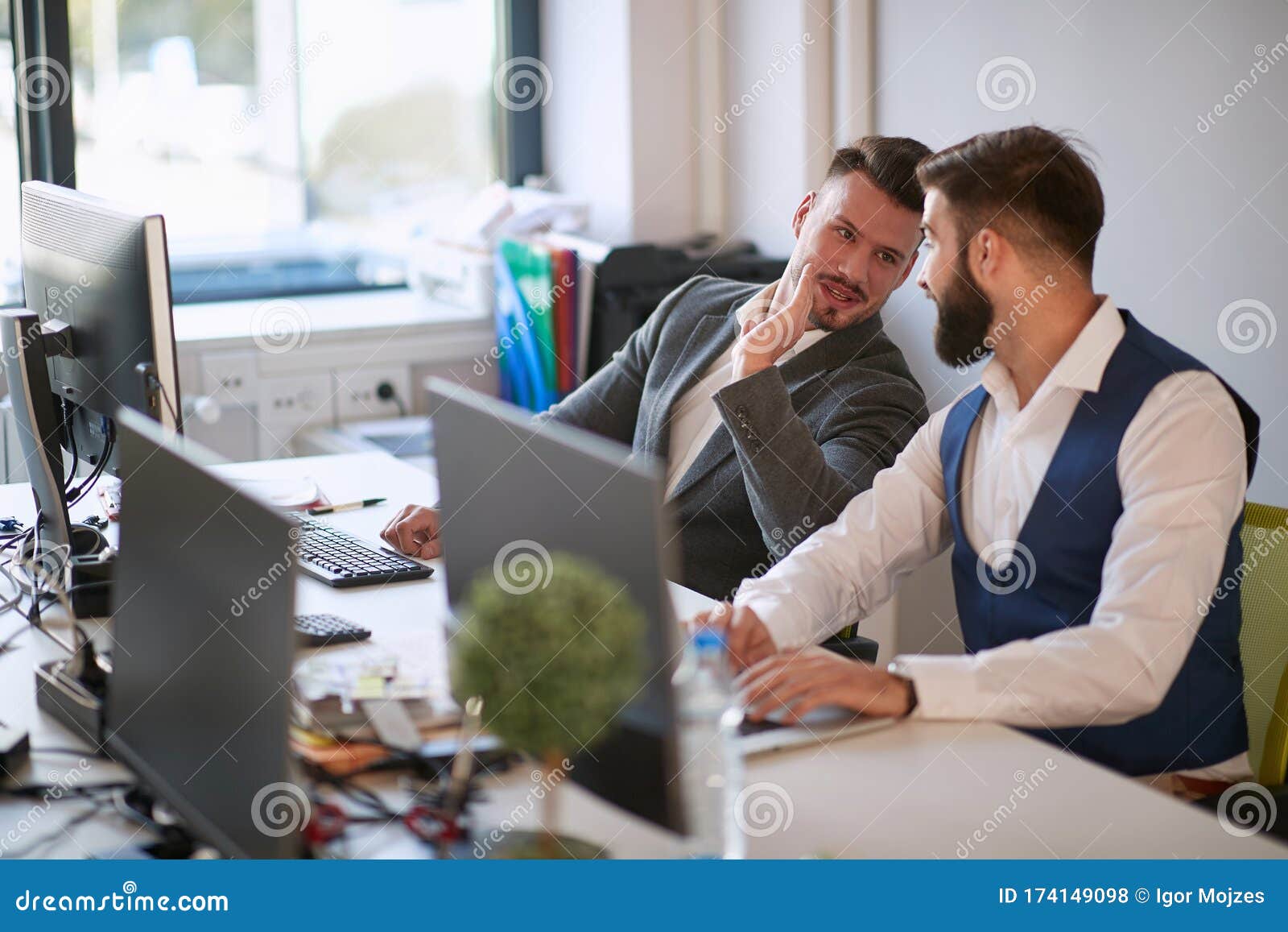 Young Business Colleagues in Office.Mens Talking at Work in Modern ...