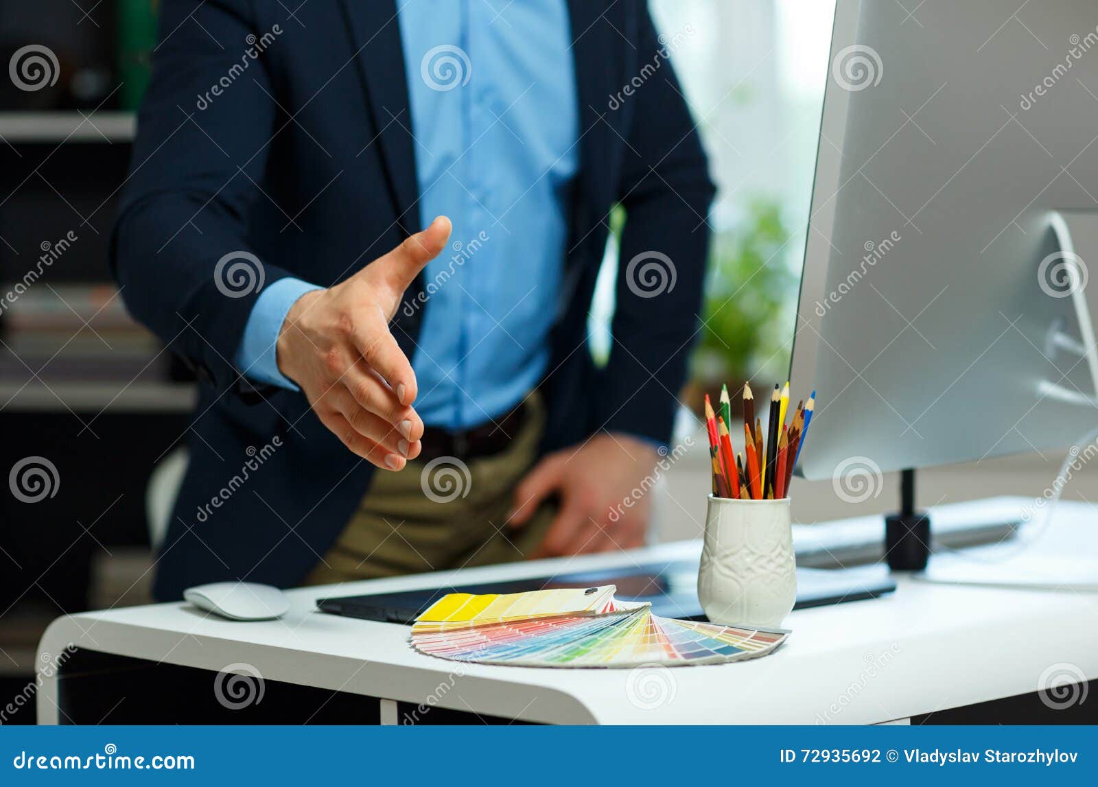 Young Business Man with Arm Extended To Handshake Stock Photo - Image ...